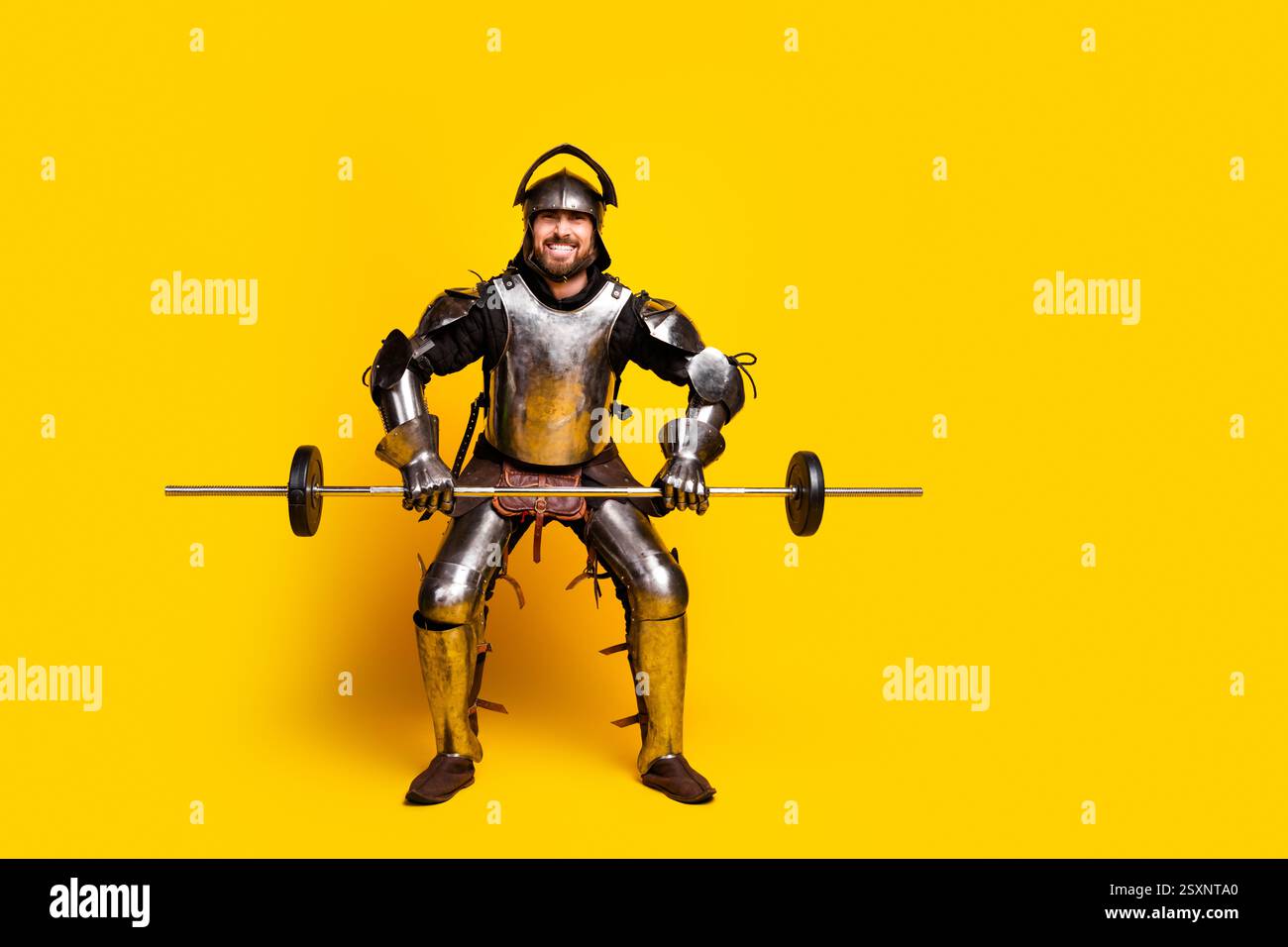 Medieval Knight in Full Armor Holding a Barbell on Bright Yellow ...