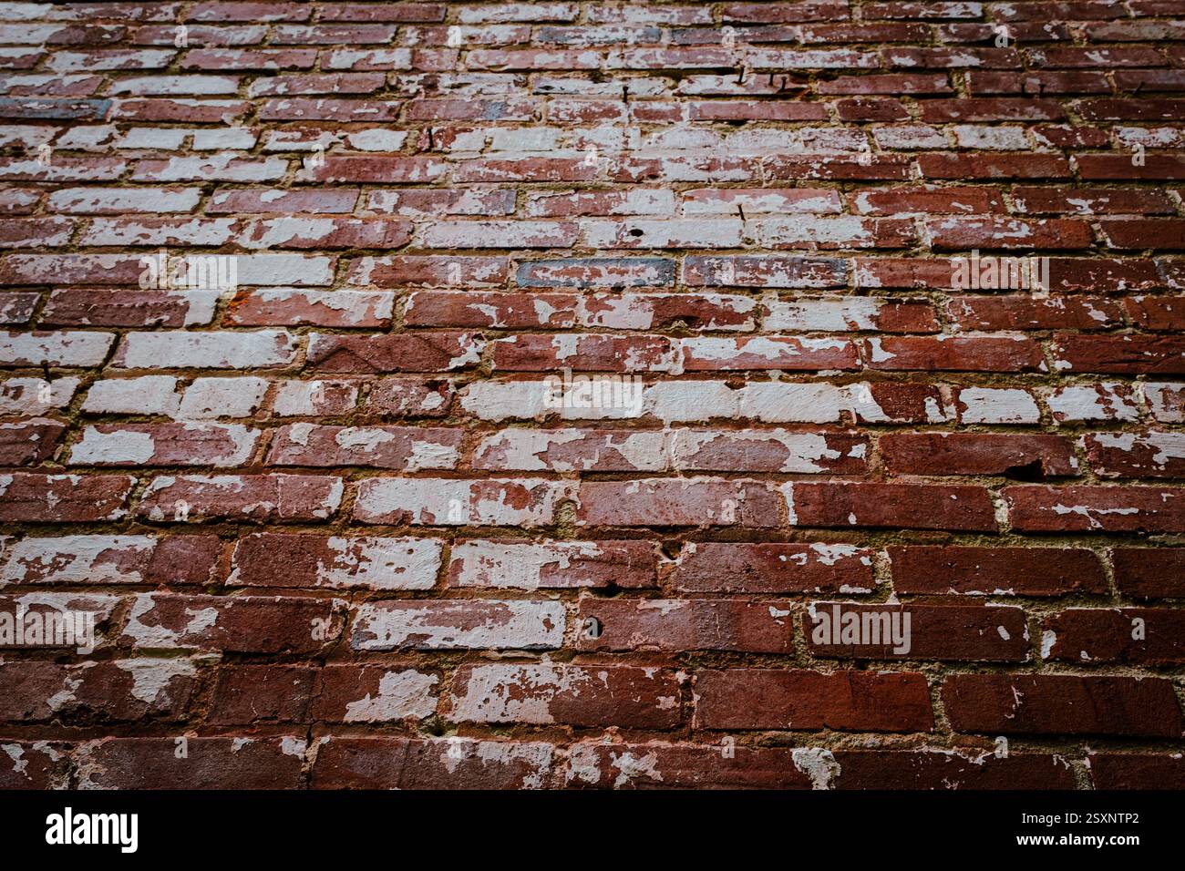 Deep red brickwork with remnants of white wash Stock Photo - Alamy