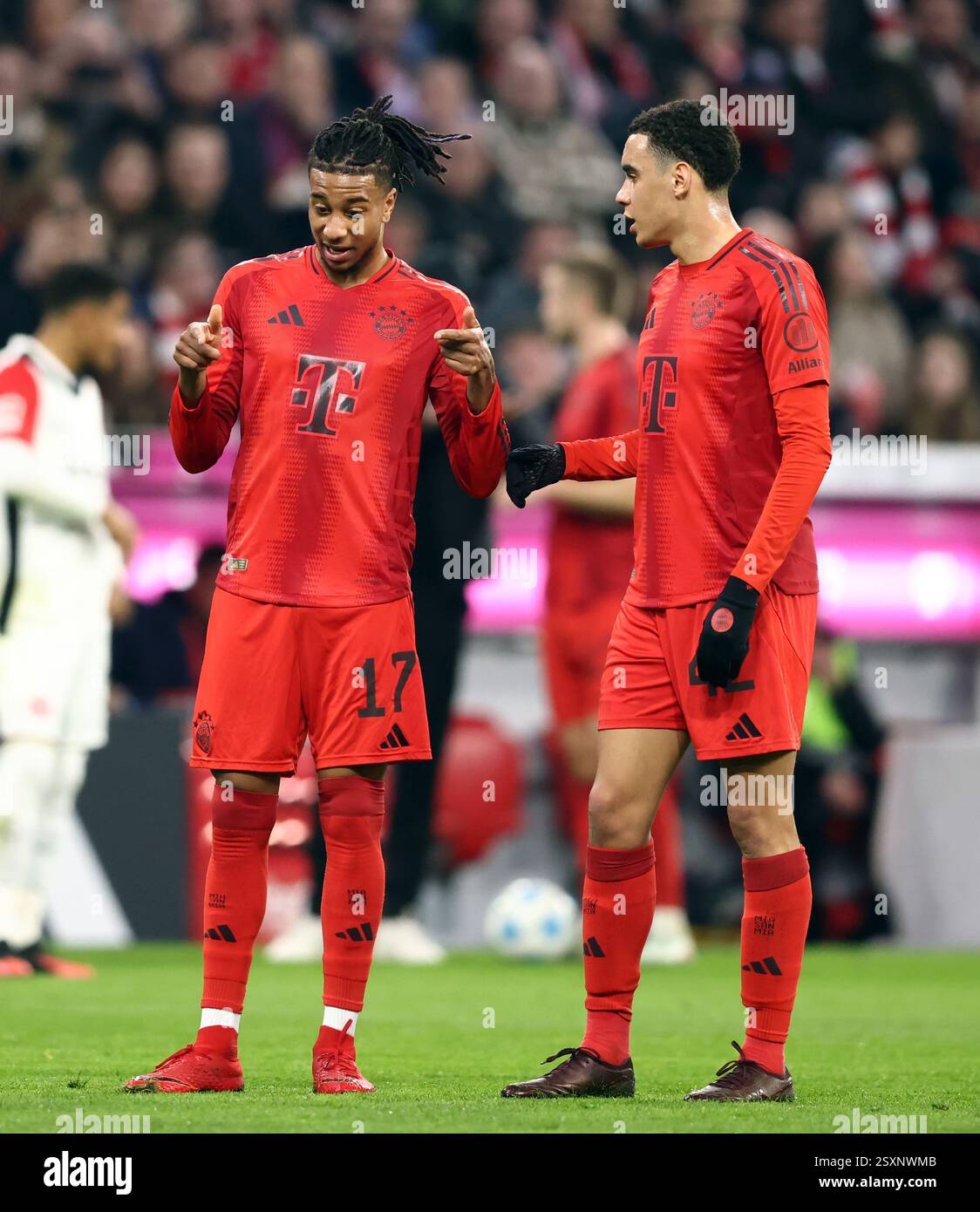 MUNICH, GERMANY - FEBRUARY 23: Michael Olise of Bayern Muenchen gives ...