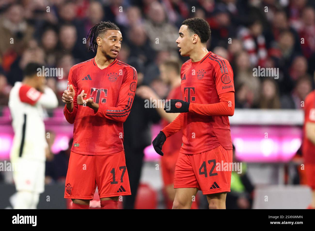 MUNICH, GERMANY - FEBRUARY 23: Michael Olise of Bayern Muenchen gives ...
