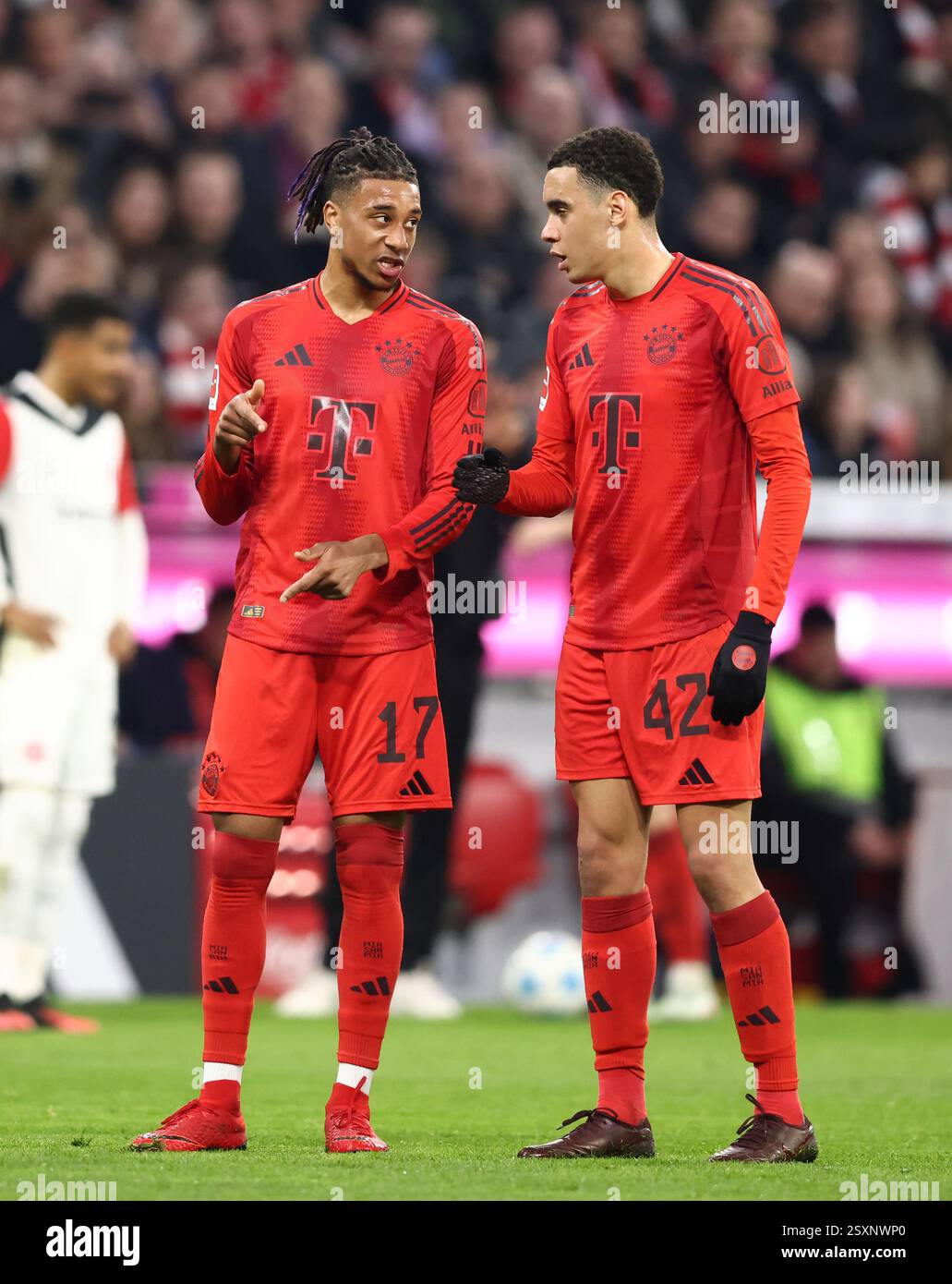 MUNICH, GERMANY - FEBRUARY 23: Michael Olise of Bayern Muenchen gives ...