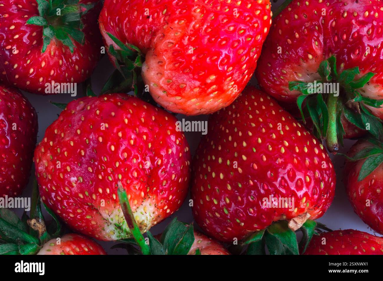 Strawberry pile slice isolated on white background Stock Photo - Alamy