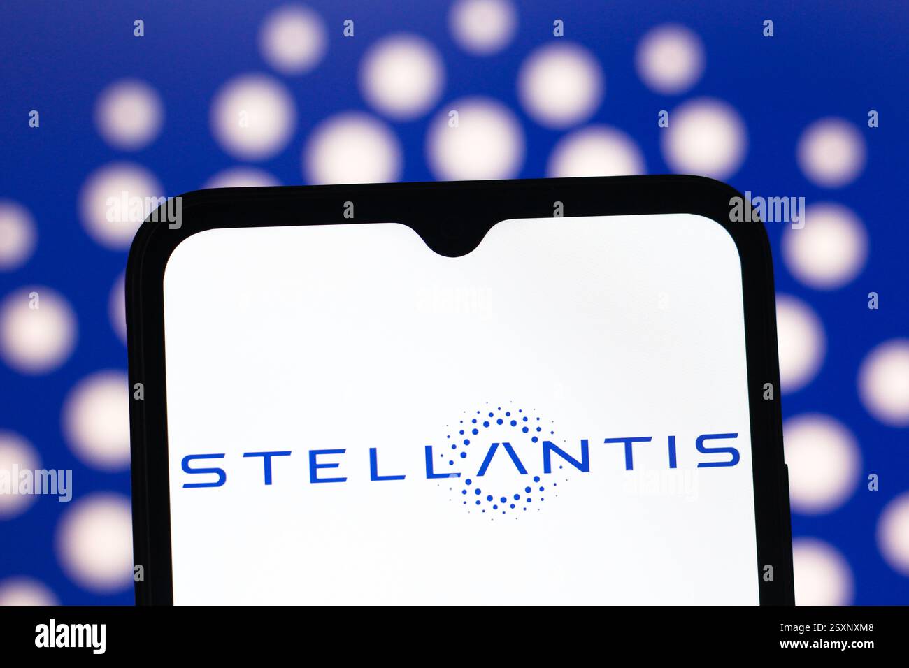 In this photo illustration, the Stellantis logo is seen displayed on a ...