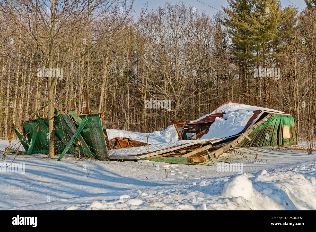 Old green barn collapses due to age and heavy snow load in winter Stock ...