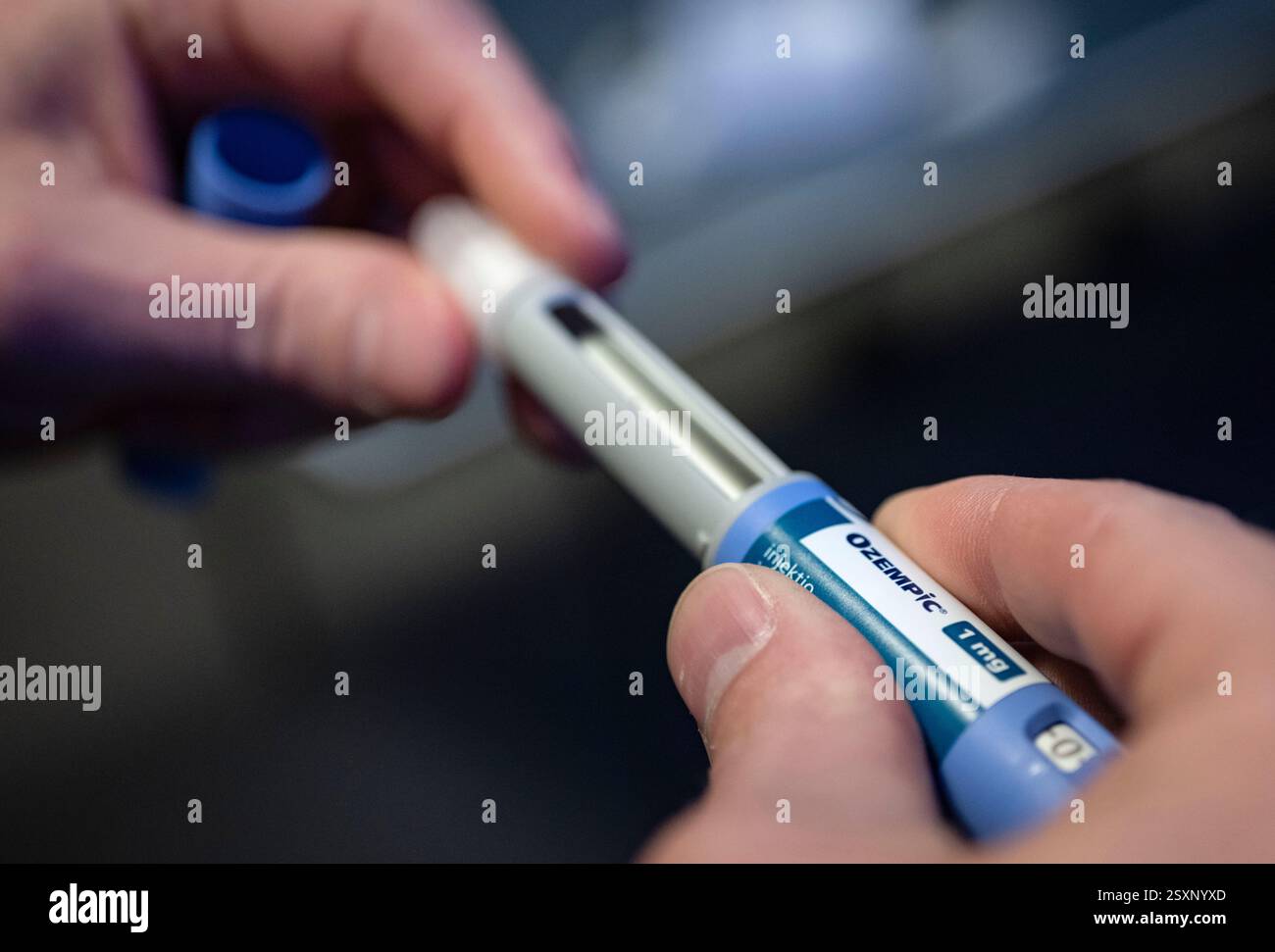 A package of Ozempic injection solution and injection pen with four ...