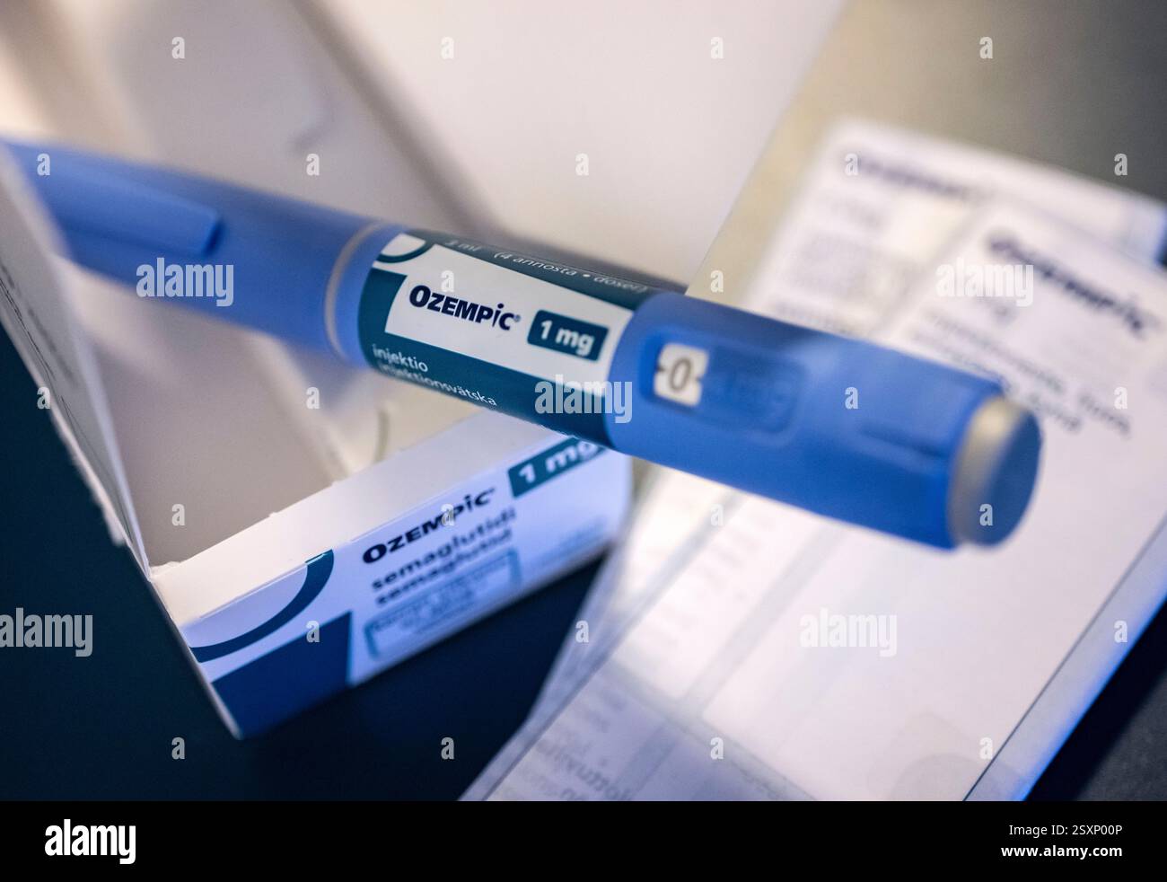A package of Ozempic injection solution and injection pen with four ...