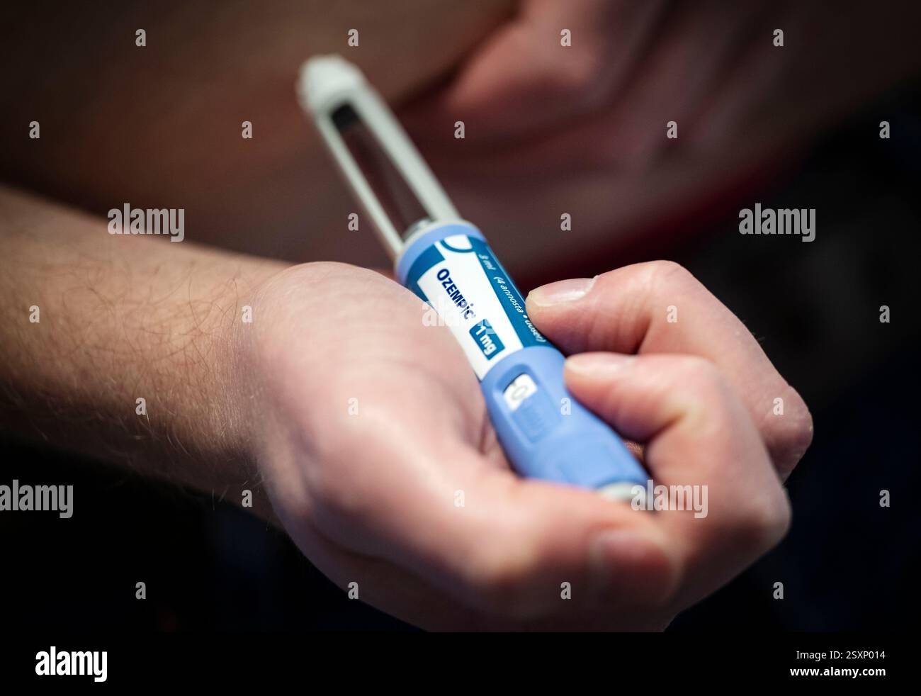 A package of Ozempic injection solution and injection pen with four ...