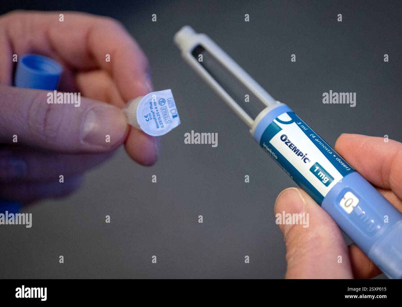 A package of Ozempic injection solution and injection pen with four ...