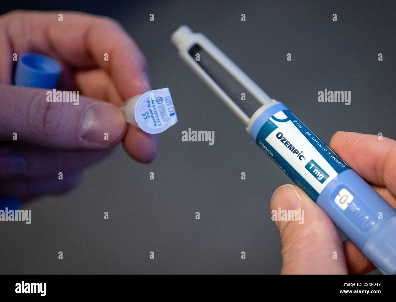 A package of Ozempic injection solution and injection pen with four ...