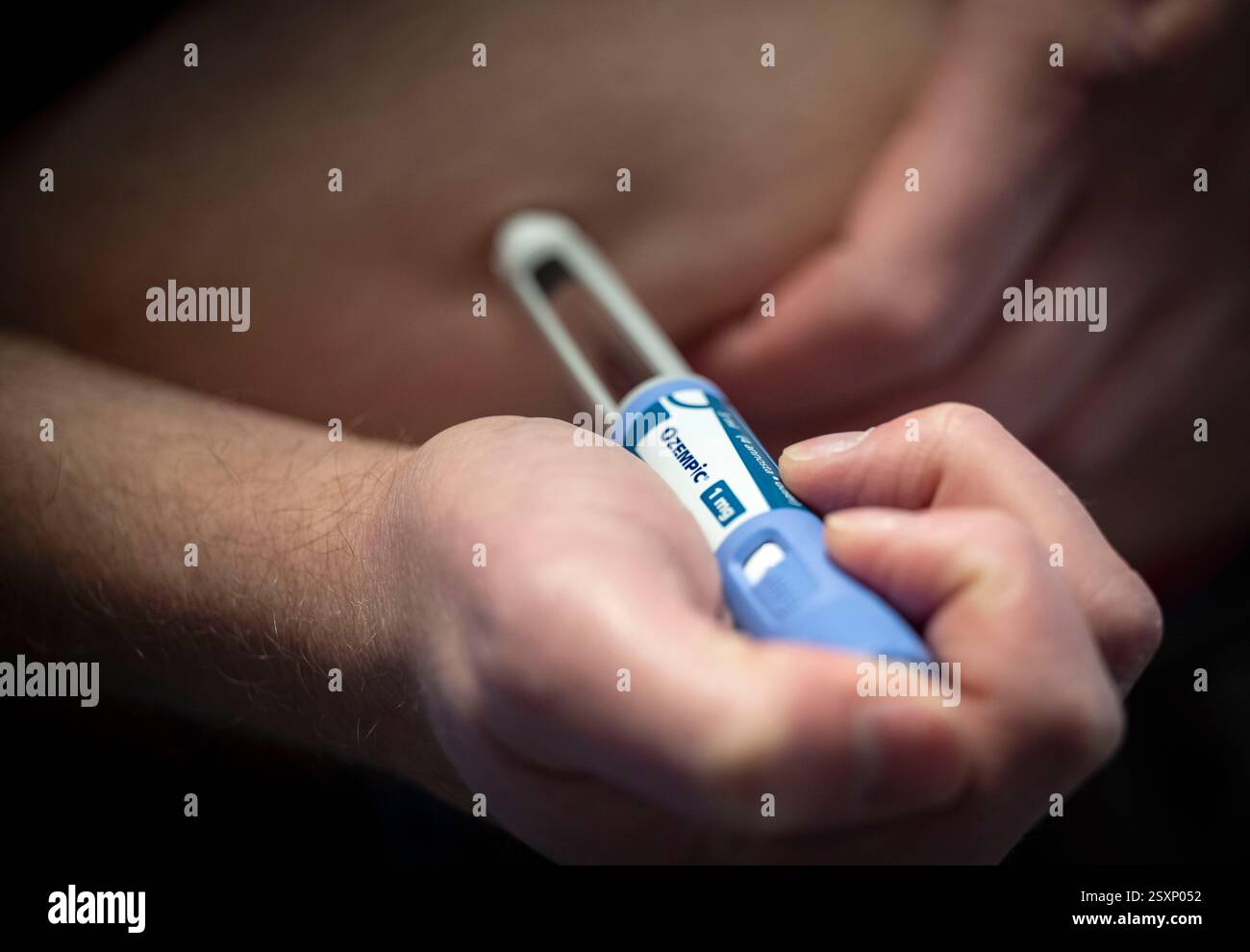 A package of Ozempic injection solution and injection pen with four ...