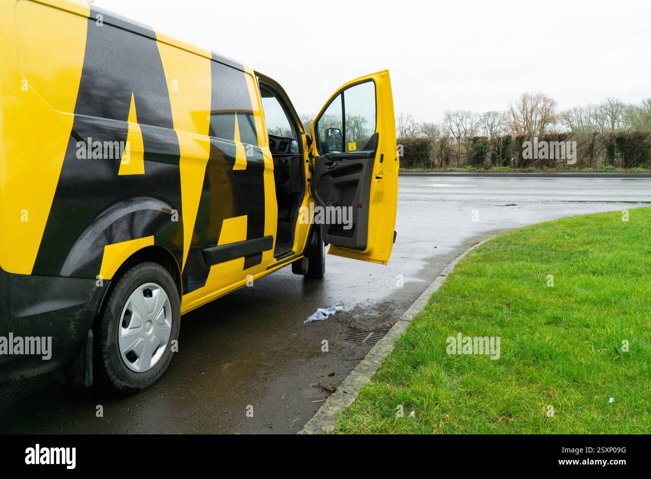 An AA van prepares to tow a white VW Golf GTE that has broken down with ...