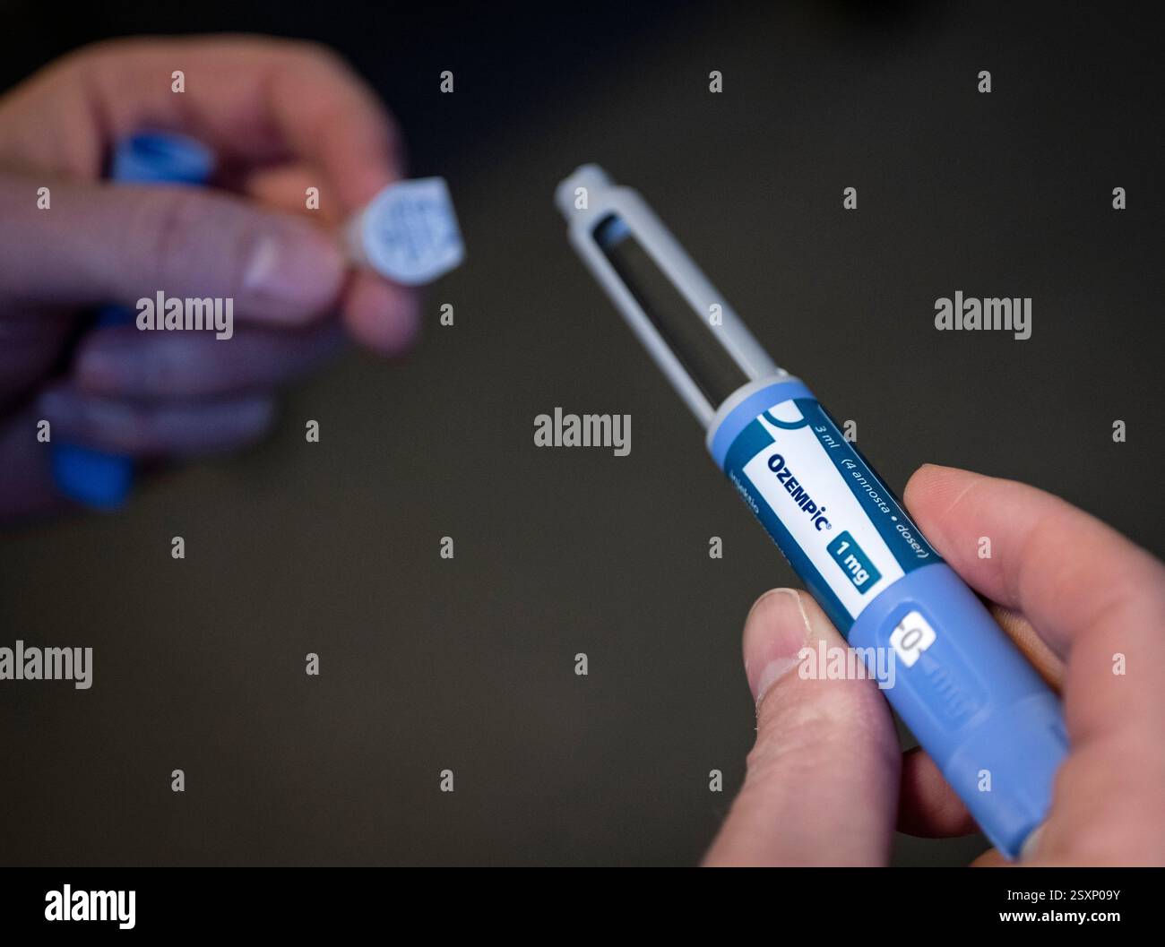 A package of Ozempic injection solution and injection pen with four ...