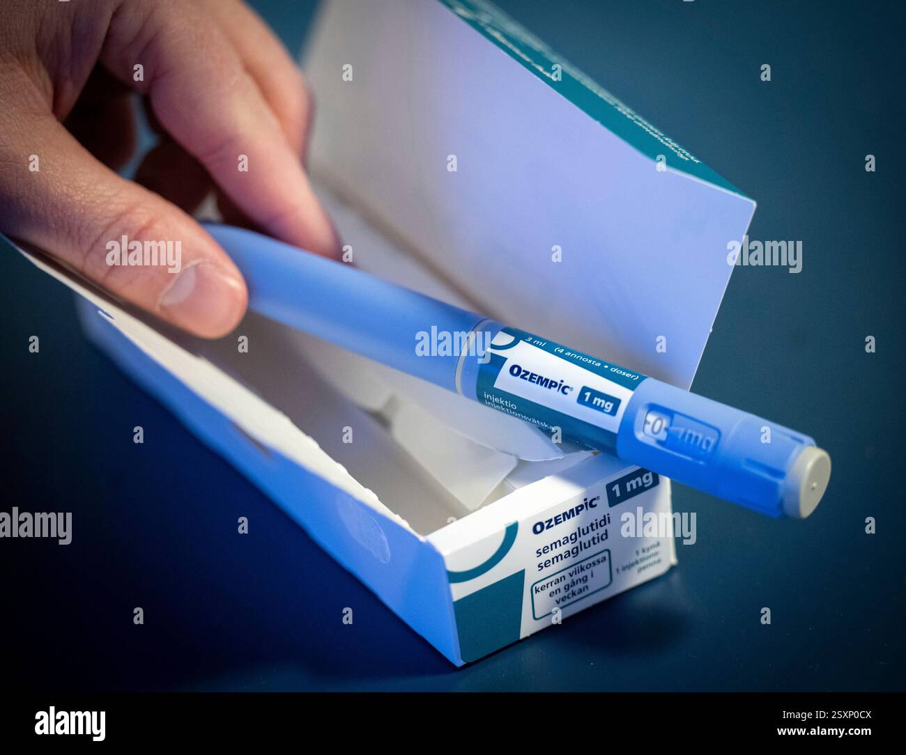A package of Ozempic injection solution and injection pen with four ...