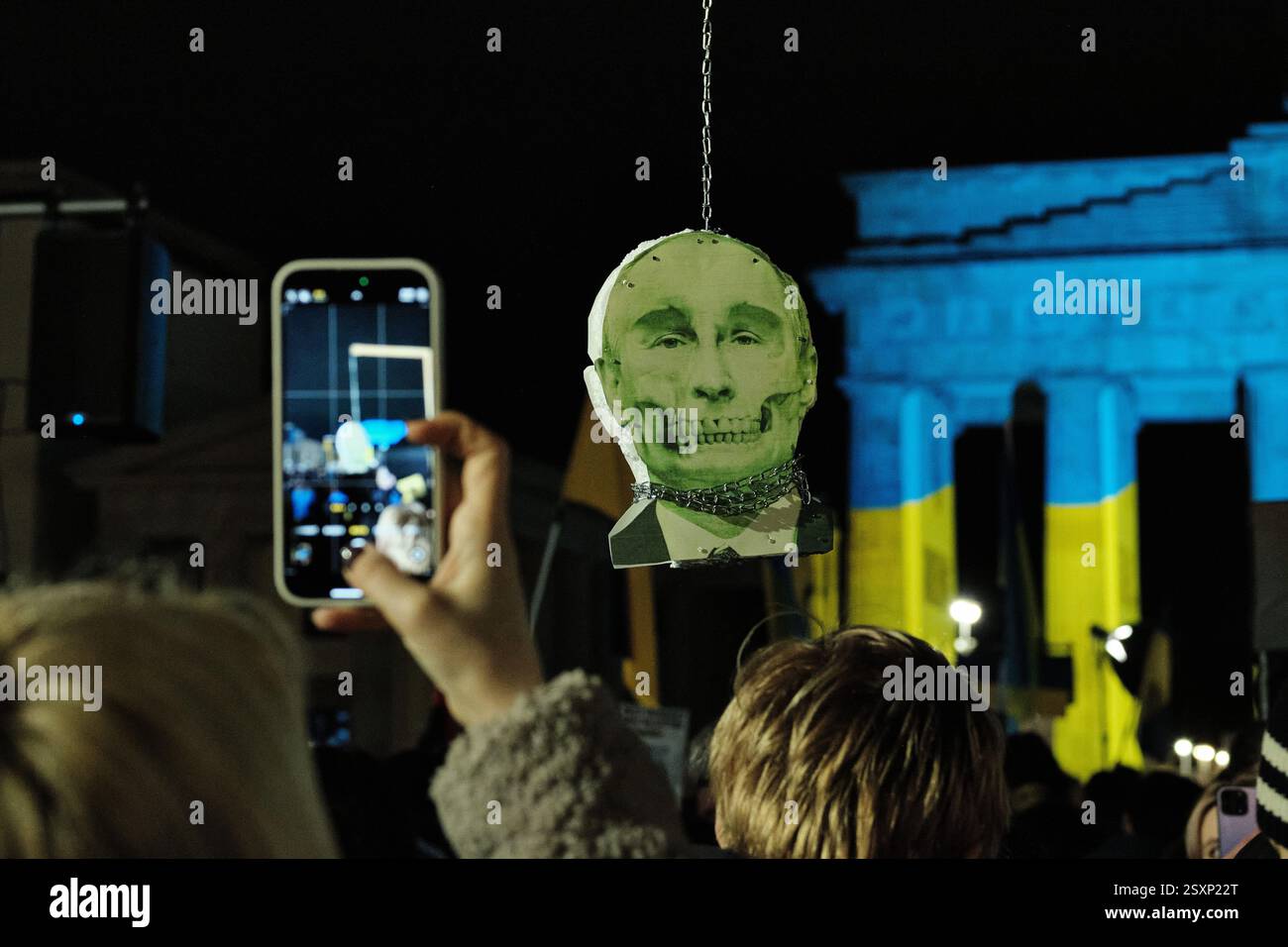 24 February 2025, Berlin: A caricature of Russian President Putin in ...