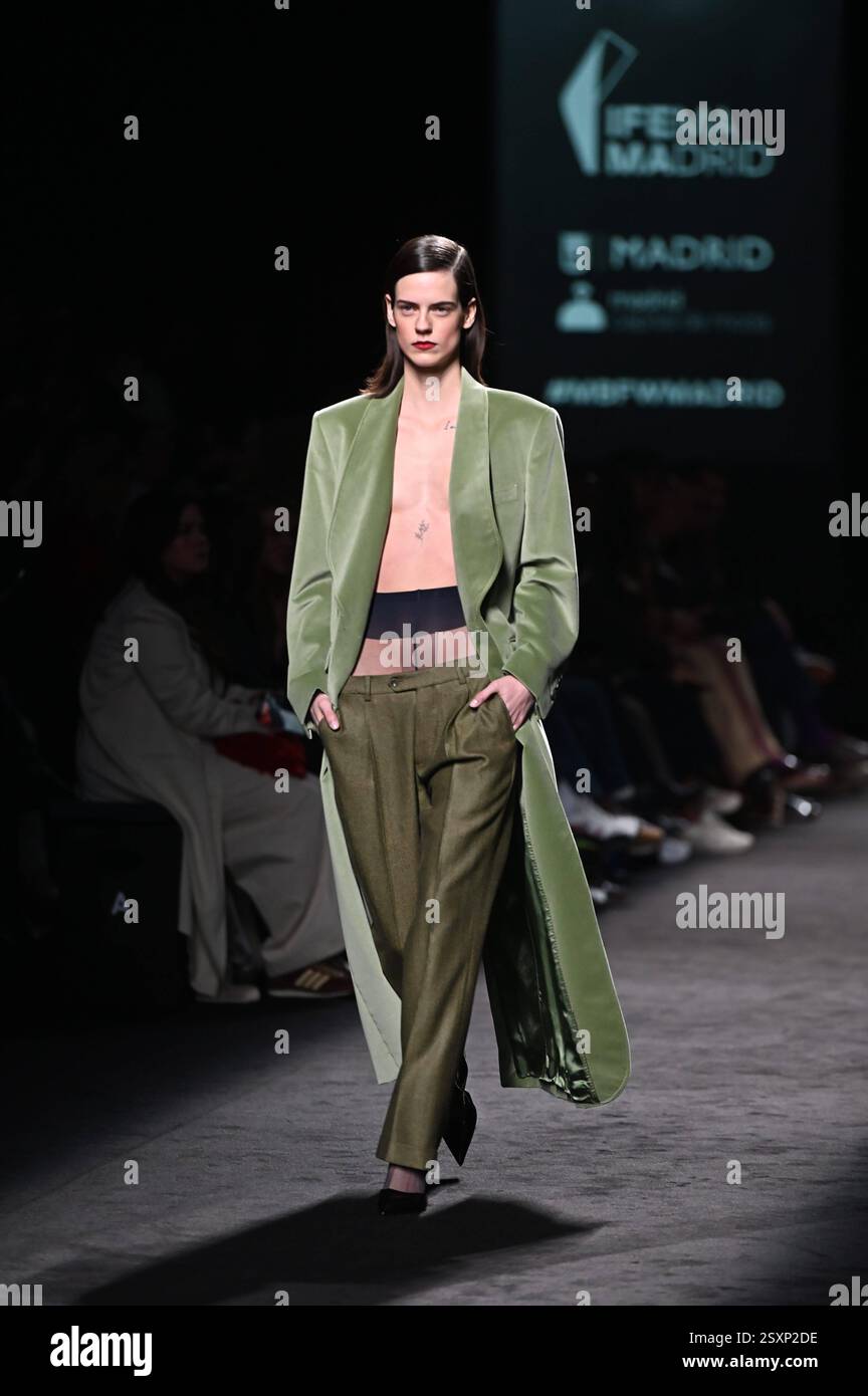 Madrid, Spain. 20th Feb, 2025. A model wears at collection runway a ...