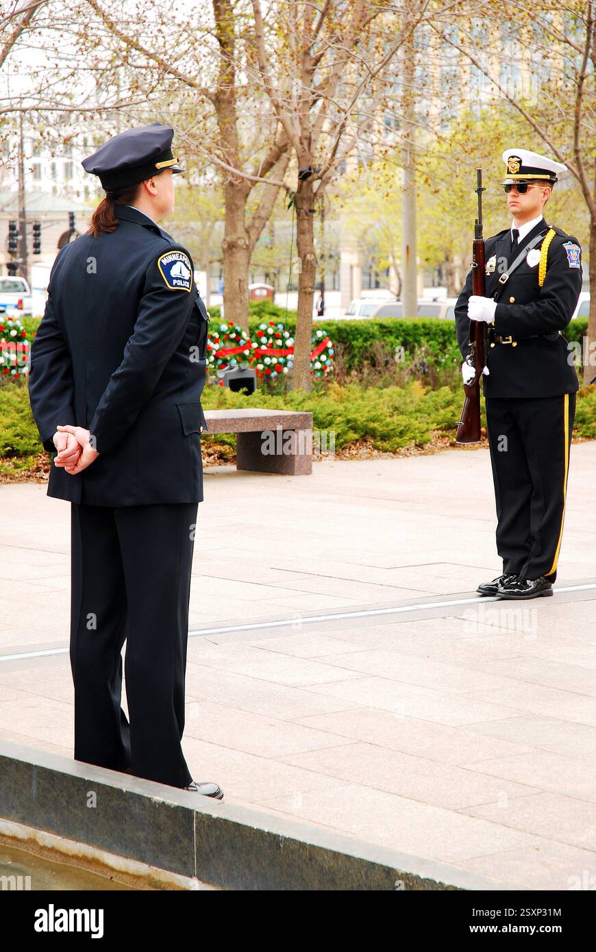 Uniformed officers participate in a solemn ceremony honoring police ...