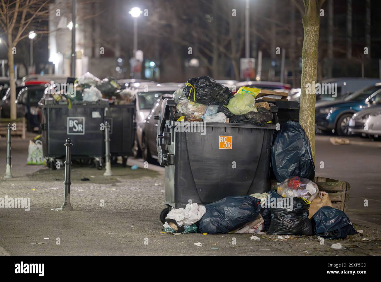 Berlin, Germany. 23rd Feb, 2025. Overflowing garbage containers with ...