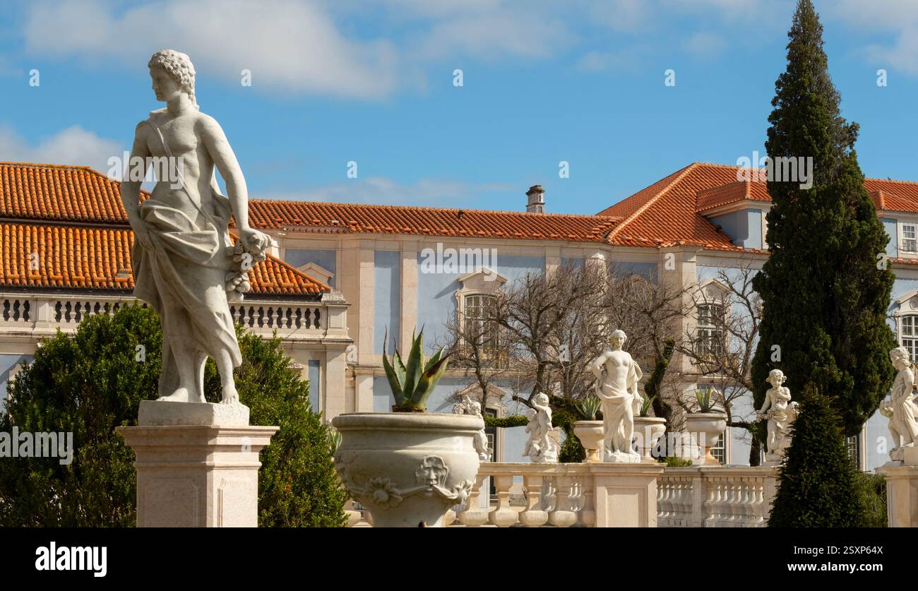 Marble statues and a carved urn on a terrace at the Palacio Nacional de ...