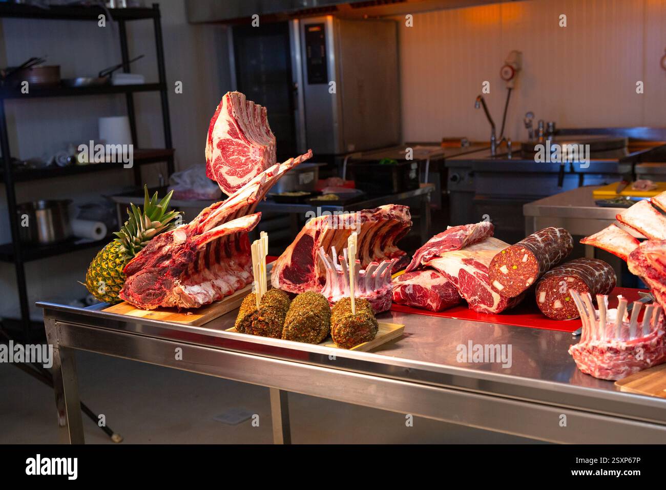 Table full of different types of meat for butchery. Beef roulade with ...