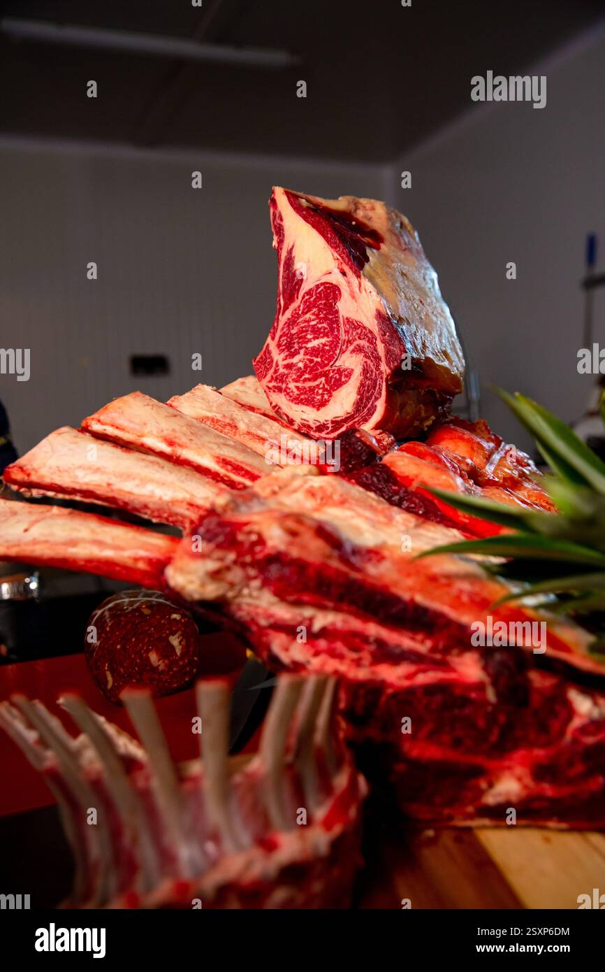 Decorative layout of meat goods on display in a butchers kitchen ...