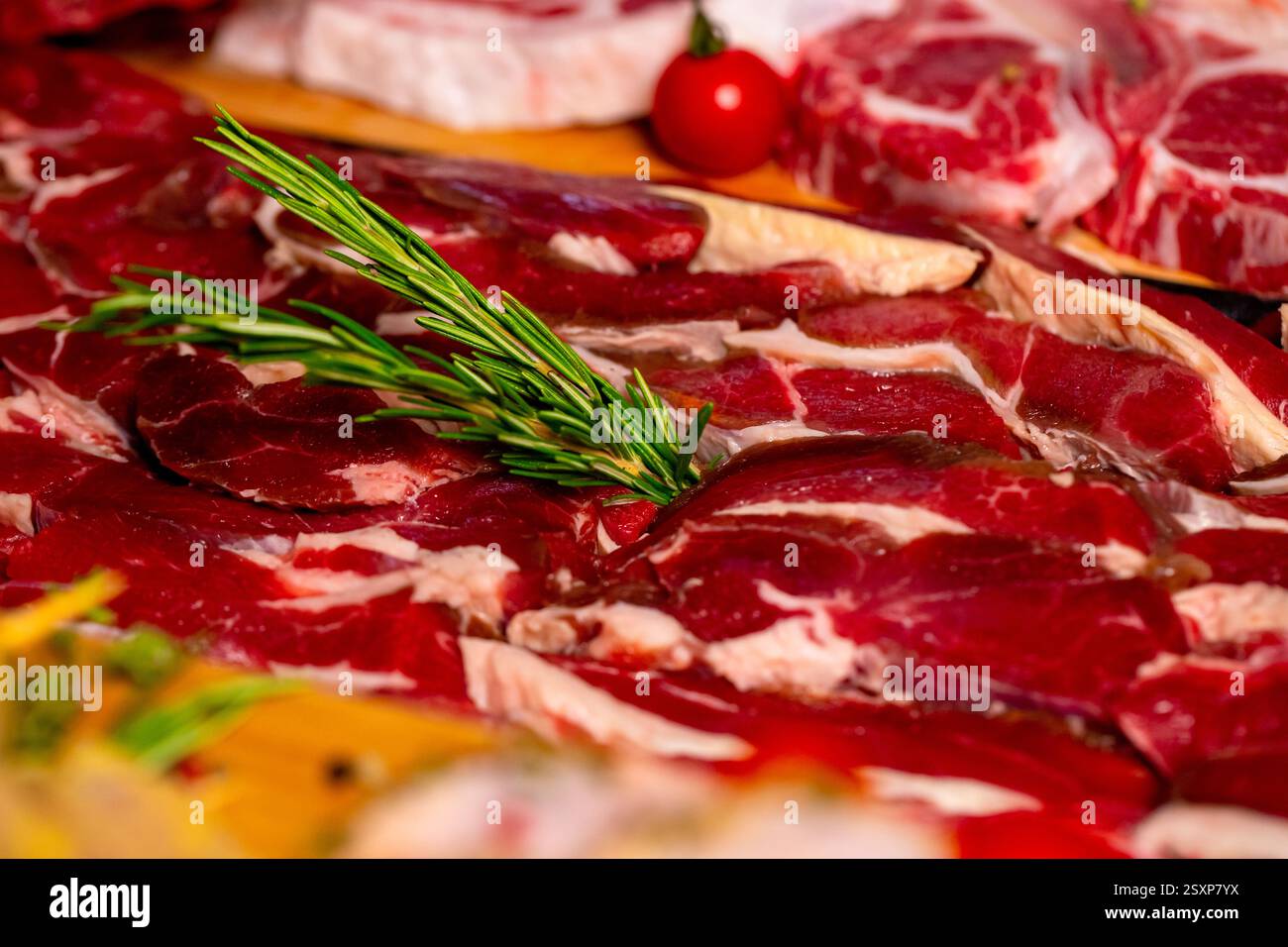 Close-up of raw meat lamb on the table in meat industry. Butchered beef ...
