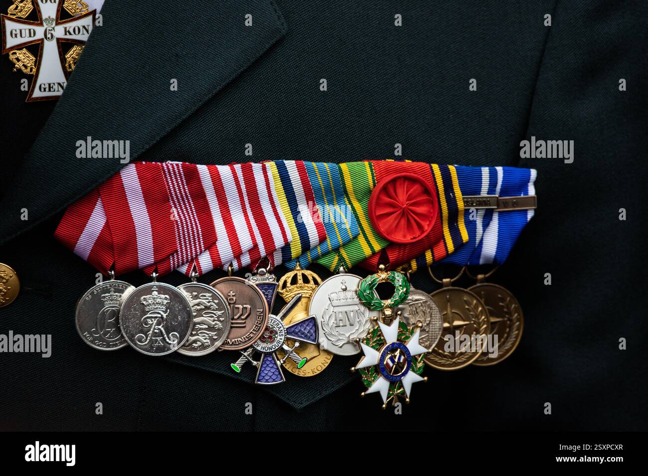 Military awards and decorations are seen on the uniform of the Chief of ...