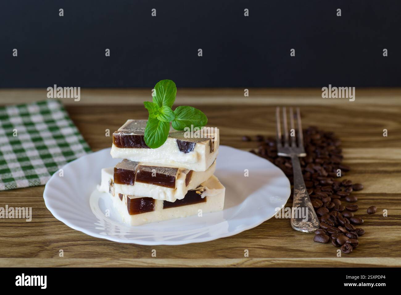 coffee jelly pieces inside white milk jelly Stock Photo - Alamy
