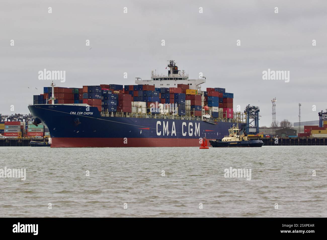 Tug boat Svitzer Sky assisting container ship CMA CGM Chopin in Harwich ...