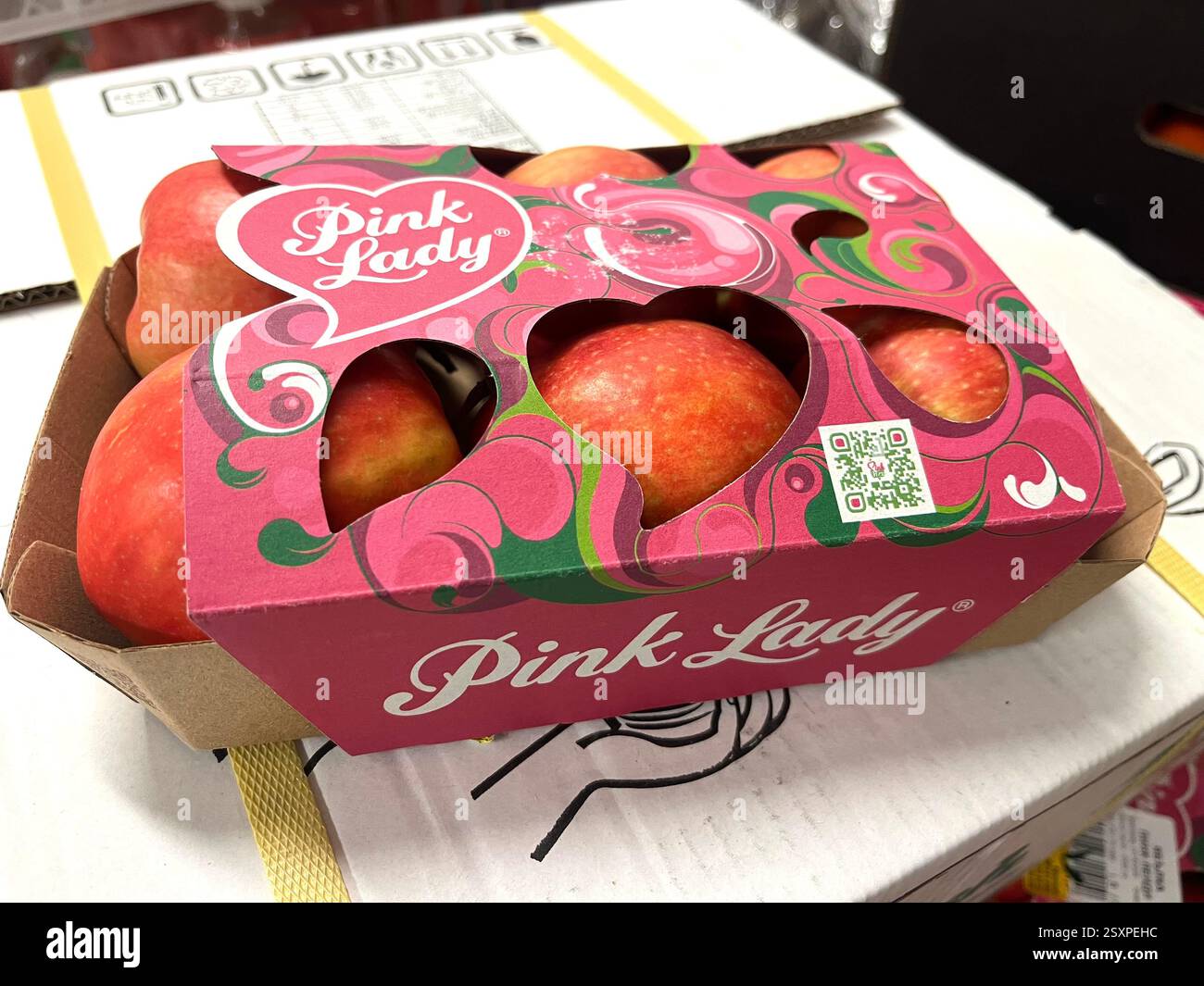 A cardboard box filled with Pink Lady apples, ready for storage and ...