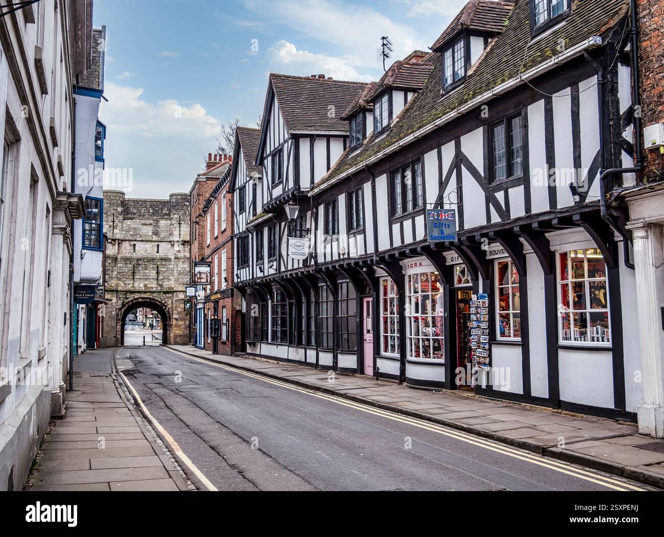 The image is of medieval York with its Tudor buildings headed by the ...