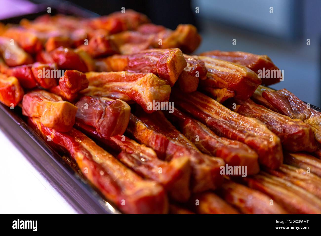 Smoked pork meat on tray for display cabinet at shop. Shop layout done ...