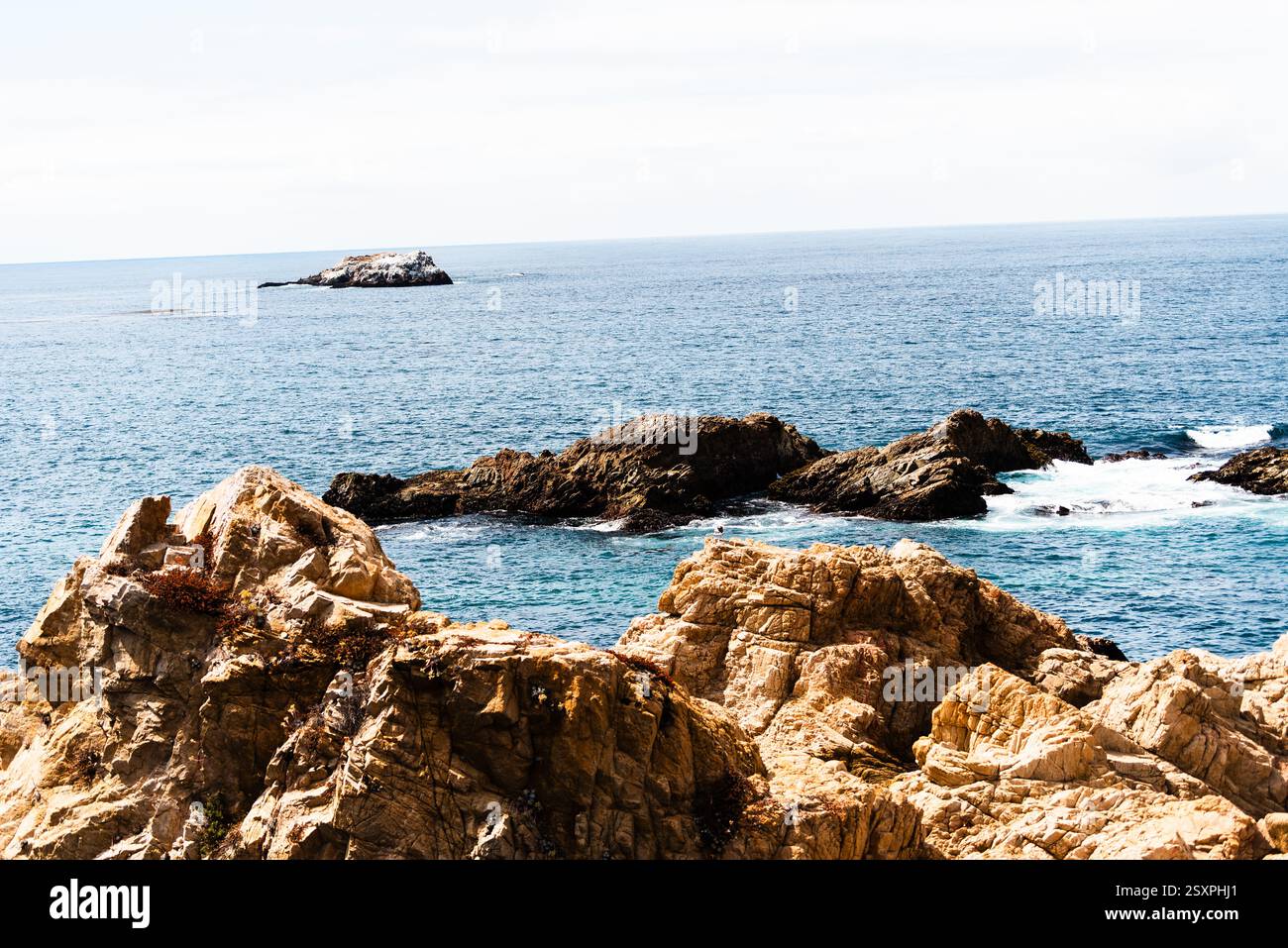 Rocky coastline and deep blue ocean at Big Sur, California Stock Photo ...
