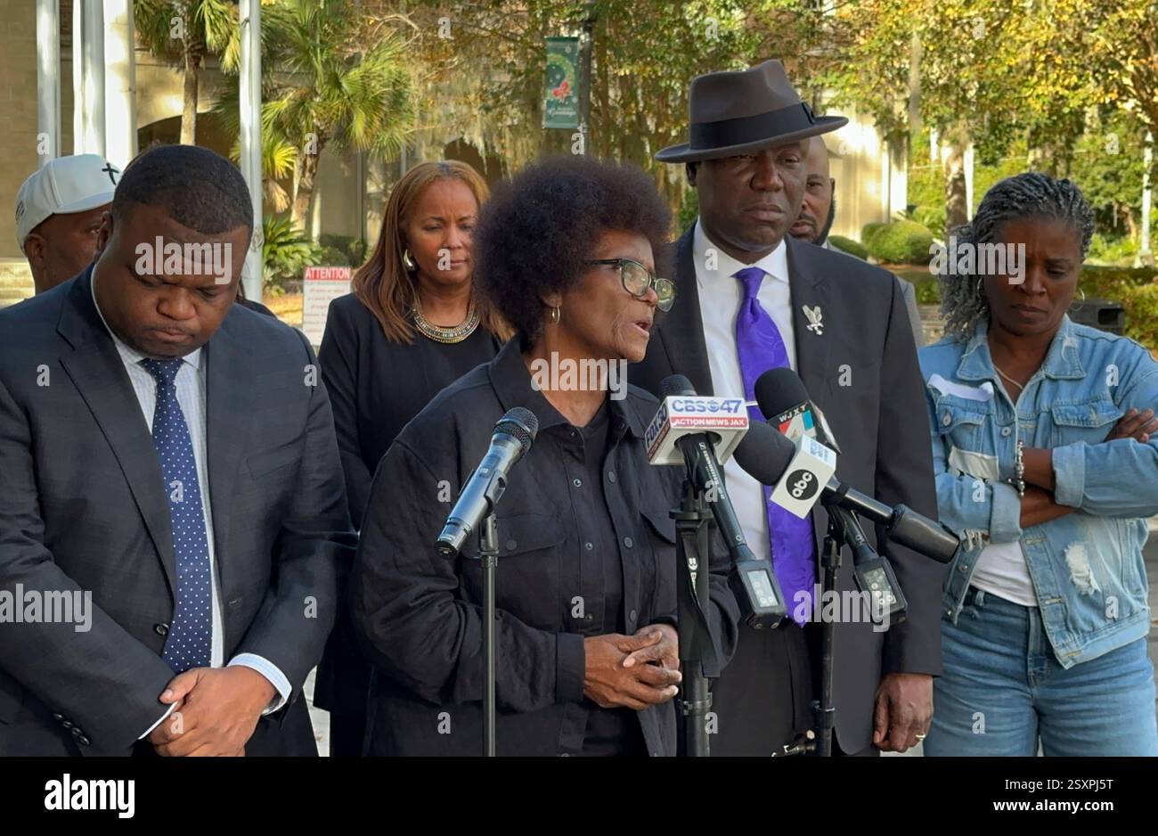 FILE - Mary Cure speaks to reporters flanked by her family's attorneys ...