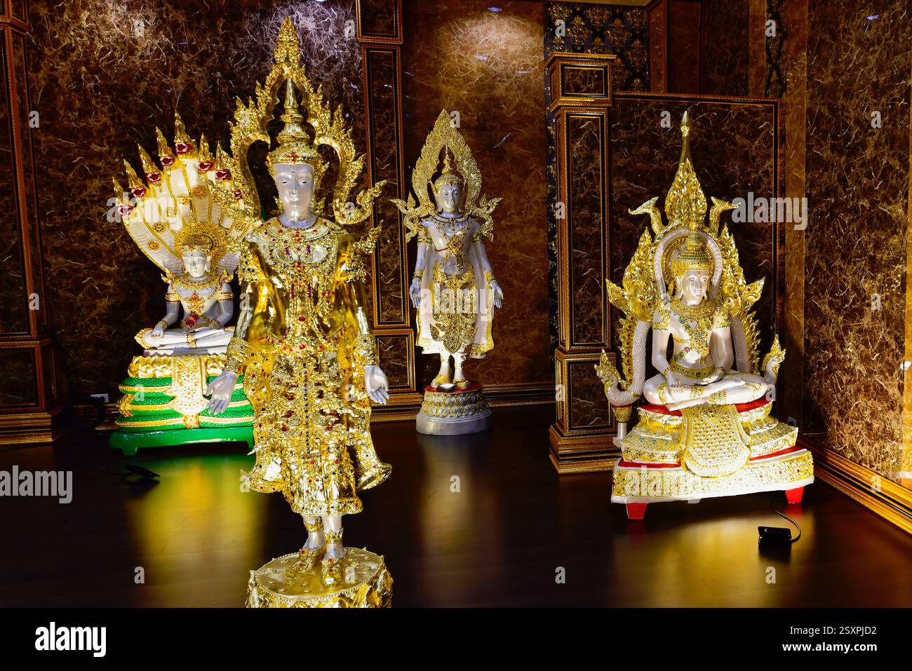 Golden Buddhist Statues shot in Bangkok Stock Photo - Alamy