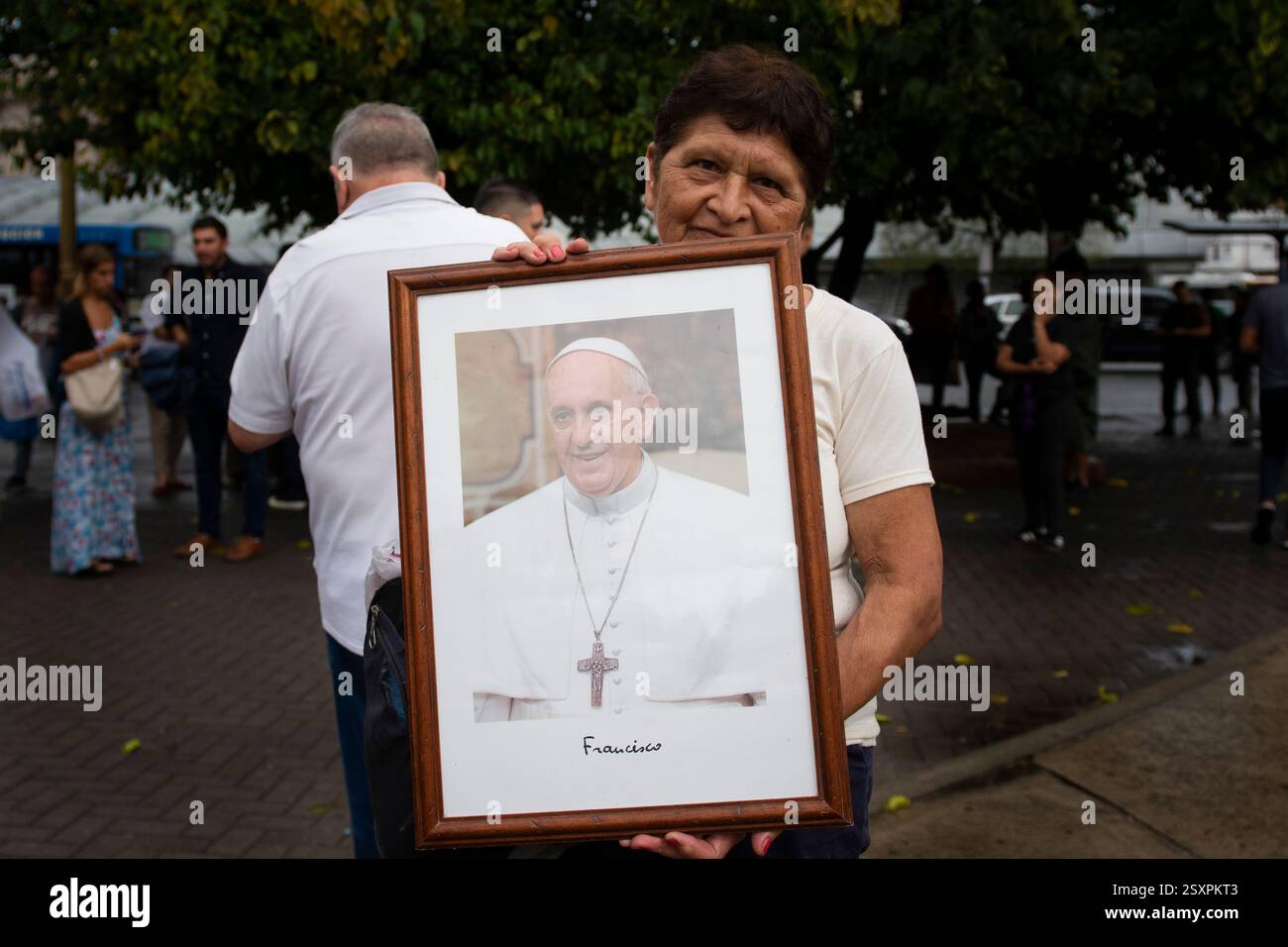 A woman holds a picture of Pope Francis in the antechamber of the ...