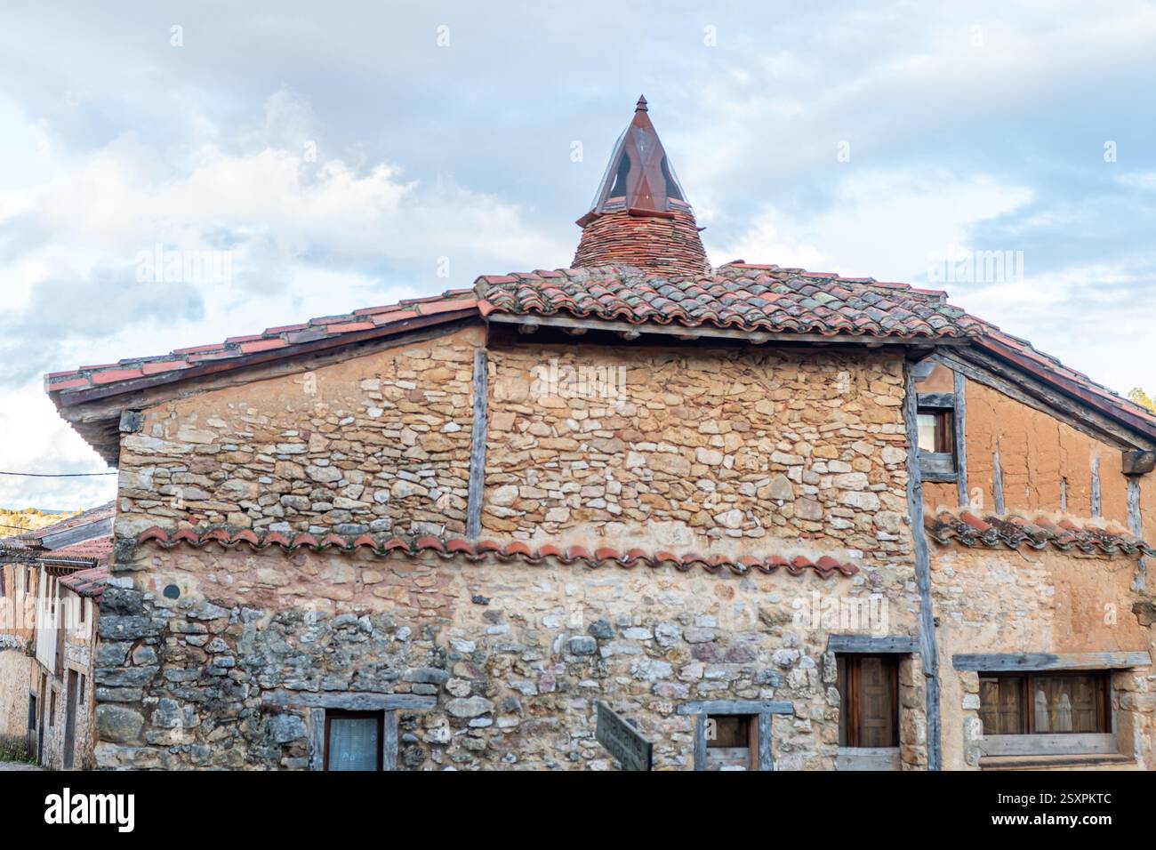 Historic stone house with tiled roof and distinctive turret in the ...