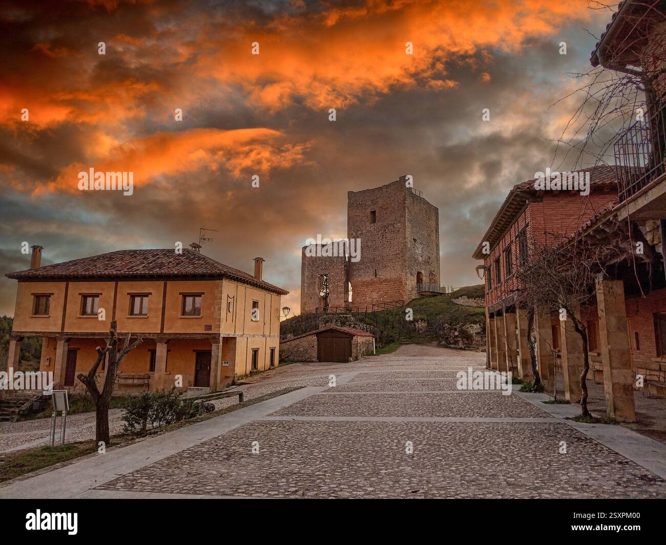A stunning sunset illuminates the ruins of the Castle of Calataazor ...
