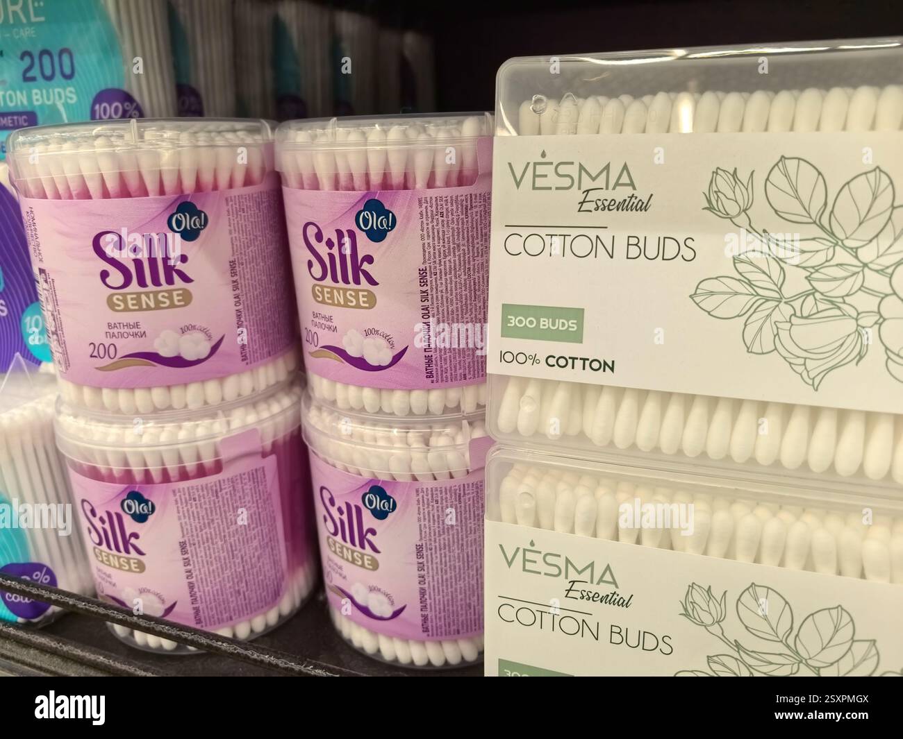 Bobruisk, Belarus - February 18, 2025: Shelves feature neatly arranged packages of cotton buds ...