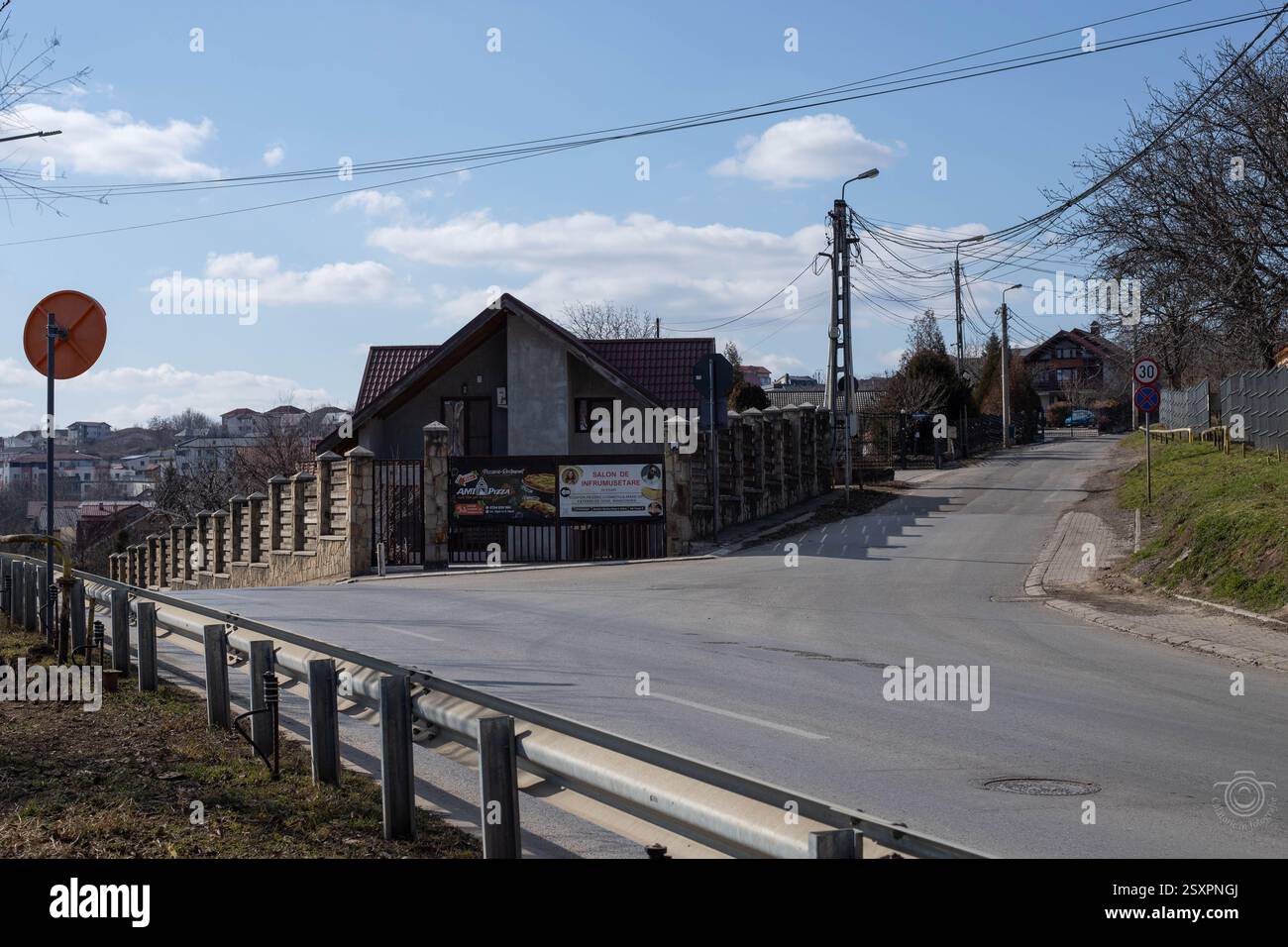 Intersection of two roads, with a house in the middle of the ...