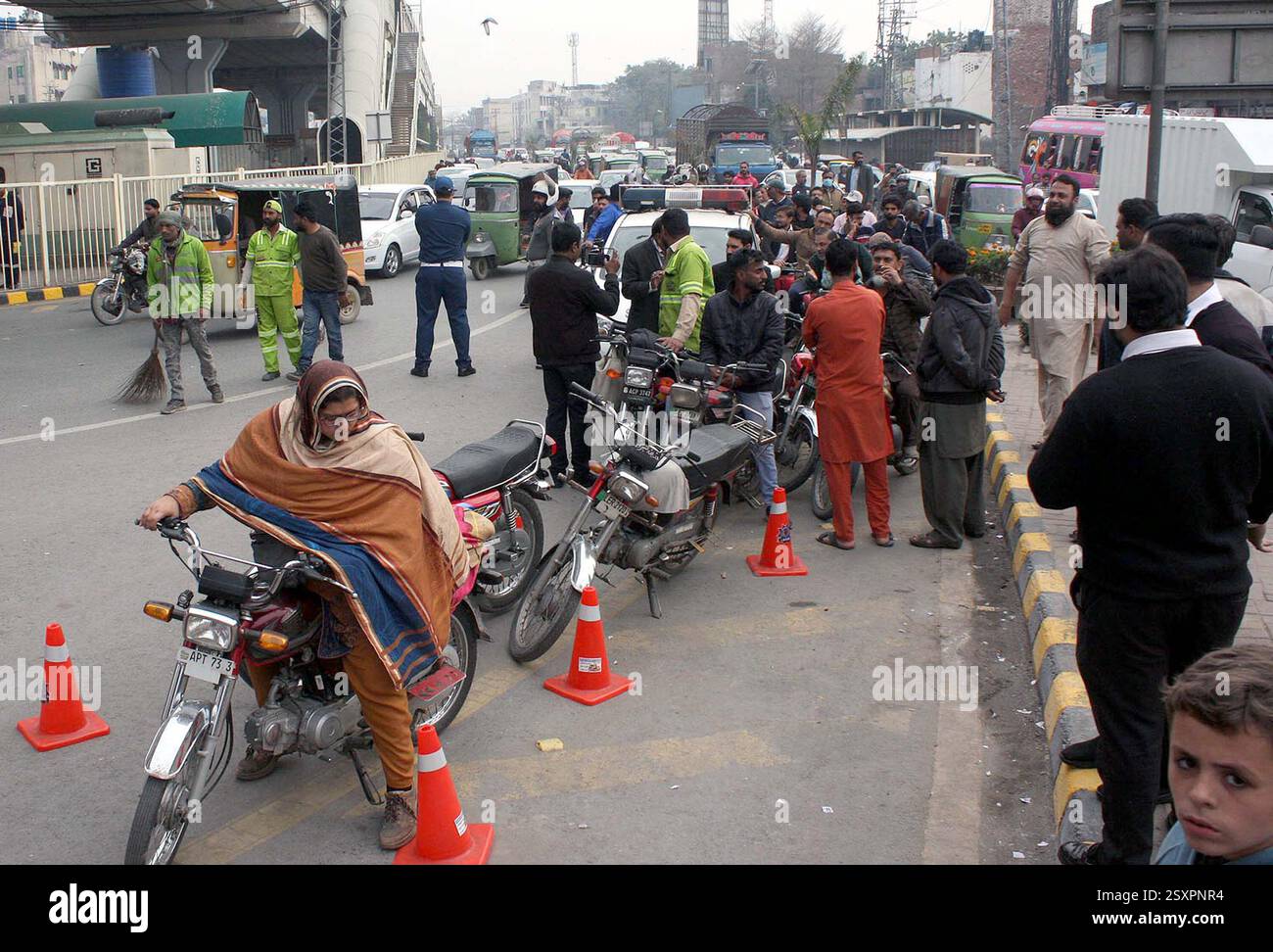Traffic wardens create awareness about helmet and traffic rule among bikers during the Helmet ...