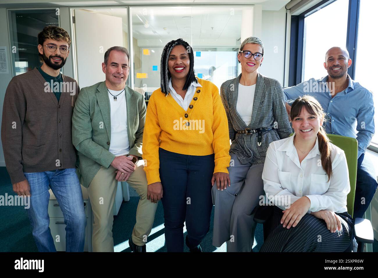 Startup business team posing together in modern office: collaboration ...