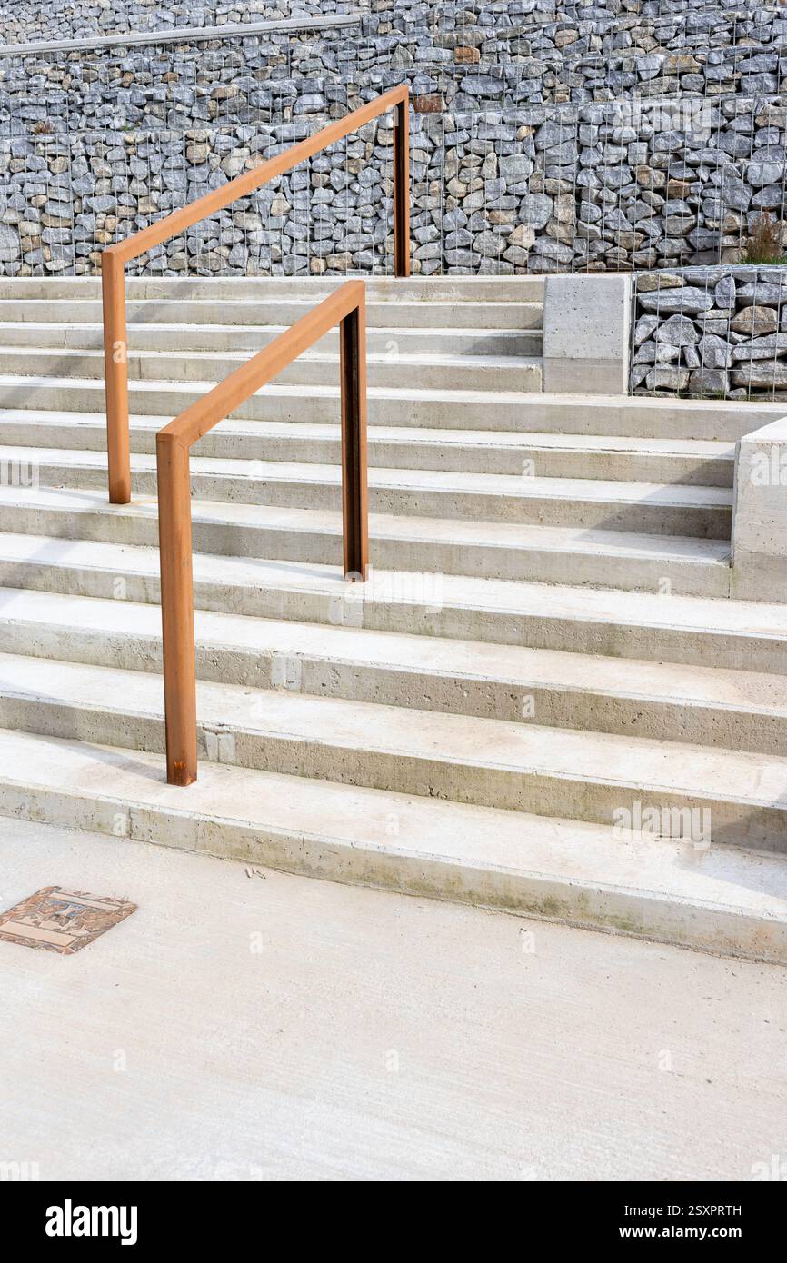 Modern public park landscaping featuring wide concrete stairs with ...