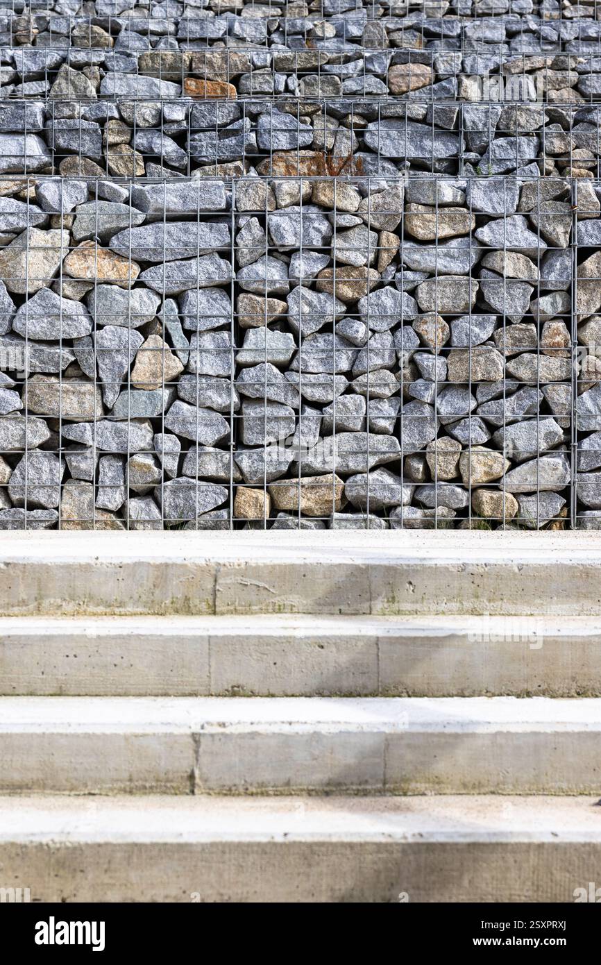 Abstract background of a concrete stairs and gabion walls made of ...