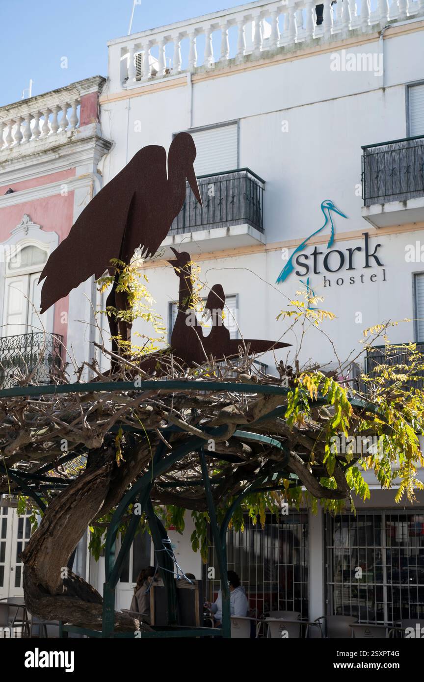 Portugal, Olhão, Algarve. Sculpture of storks in front of Stork Hostel ...