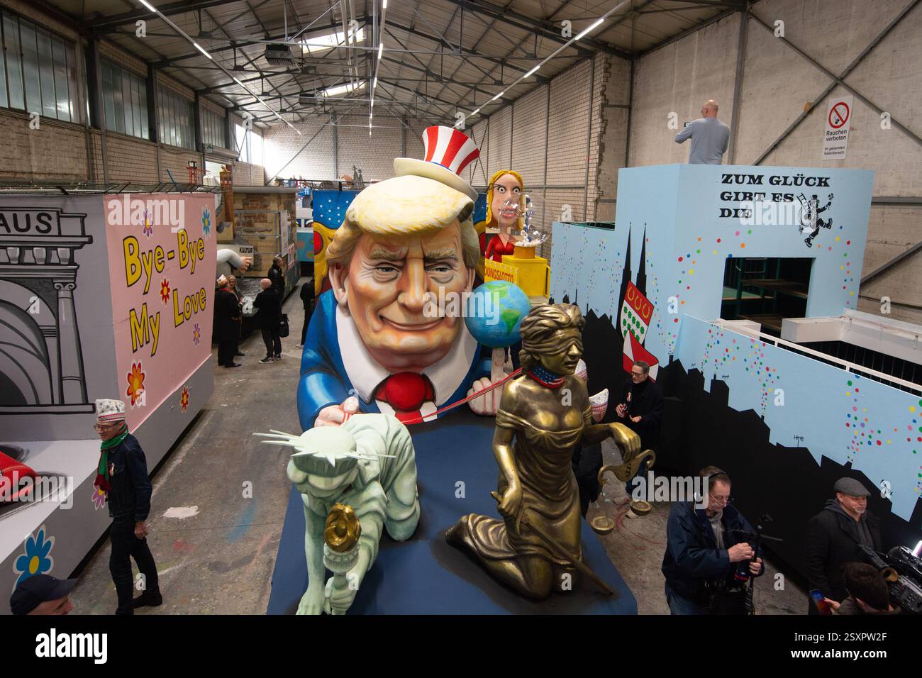 A carnival float features US President Donald Trump holding a leash on ...