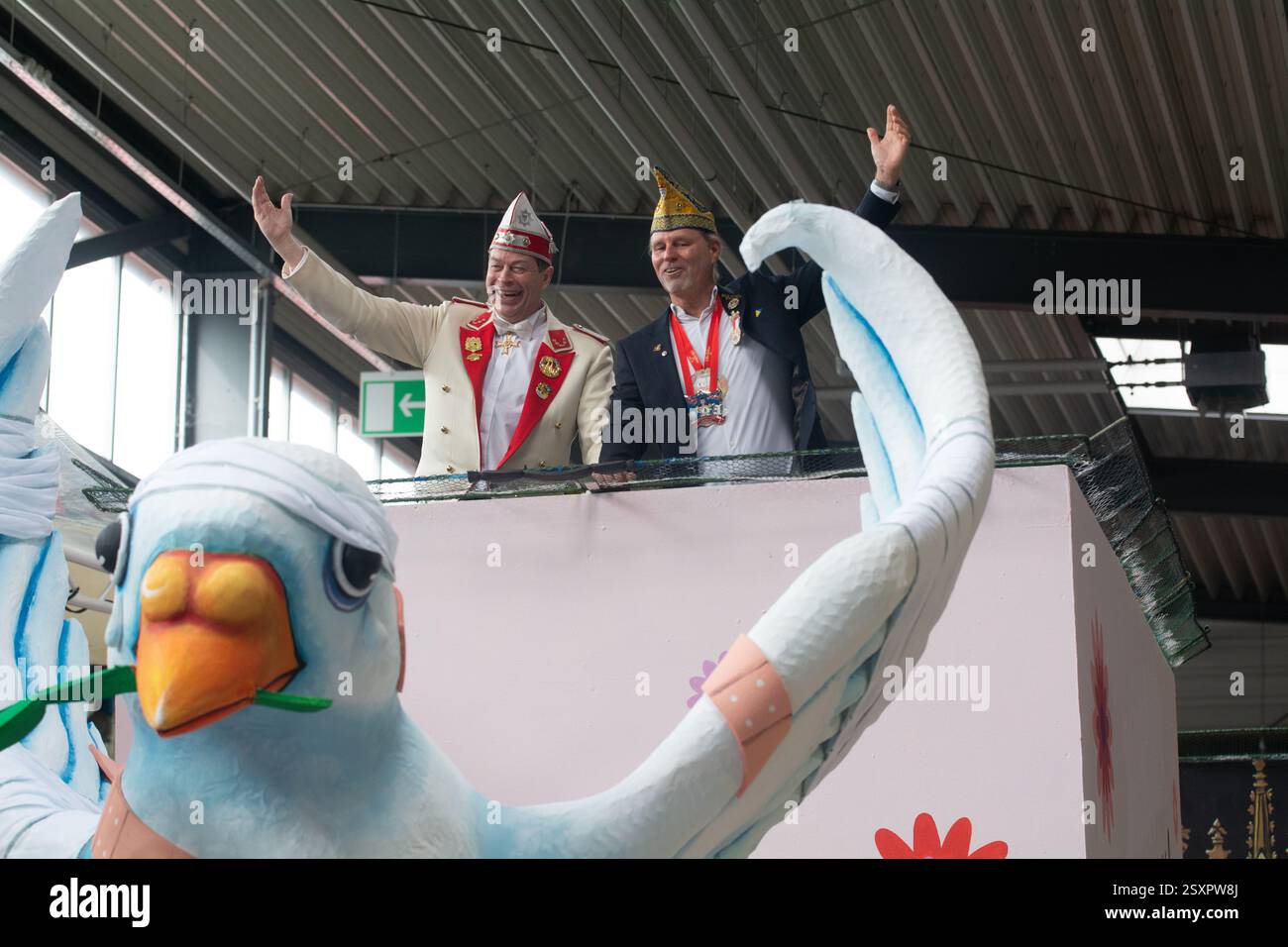 Cologne, Germany. 25th Feb, 2025. A carnival float with two carnival ...