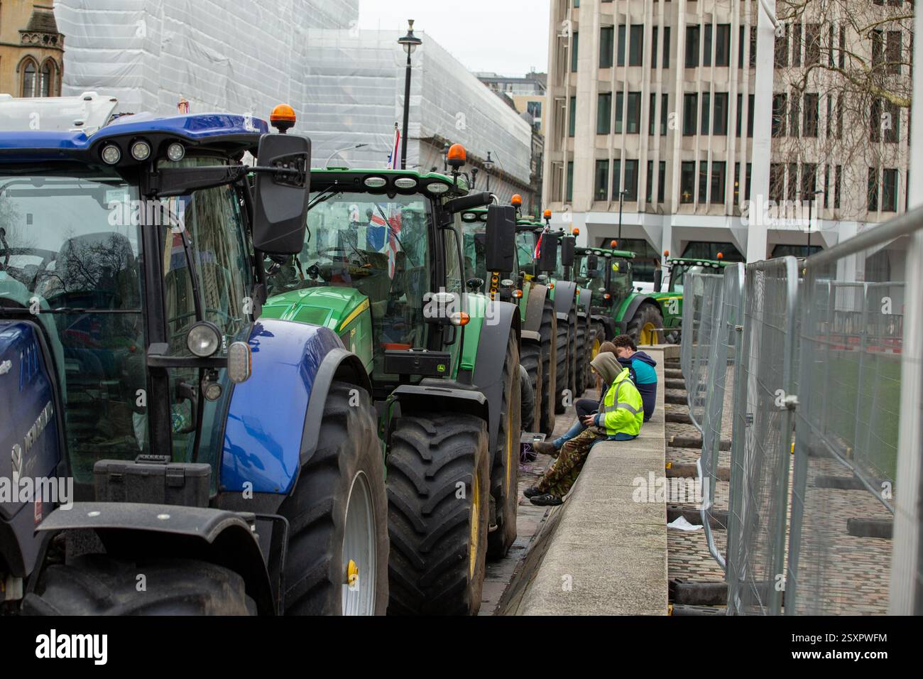 London, UK. 25th Feb 2025 Farmers park tractors and display toy ...