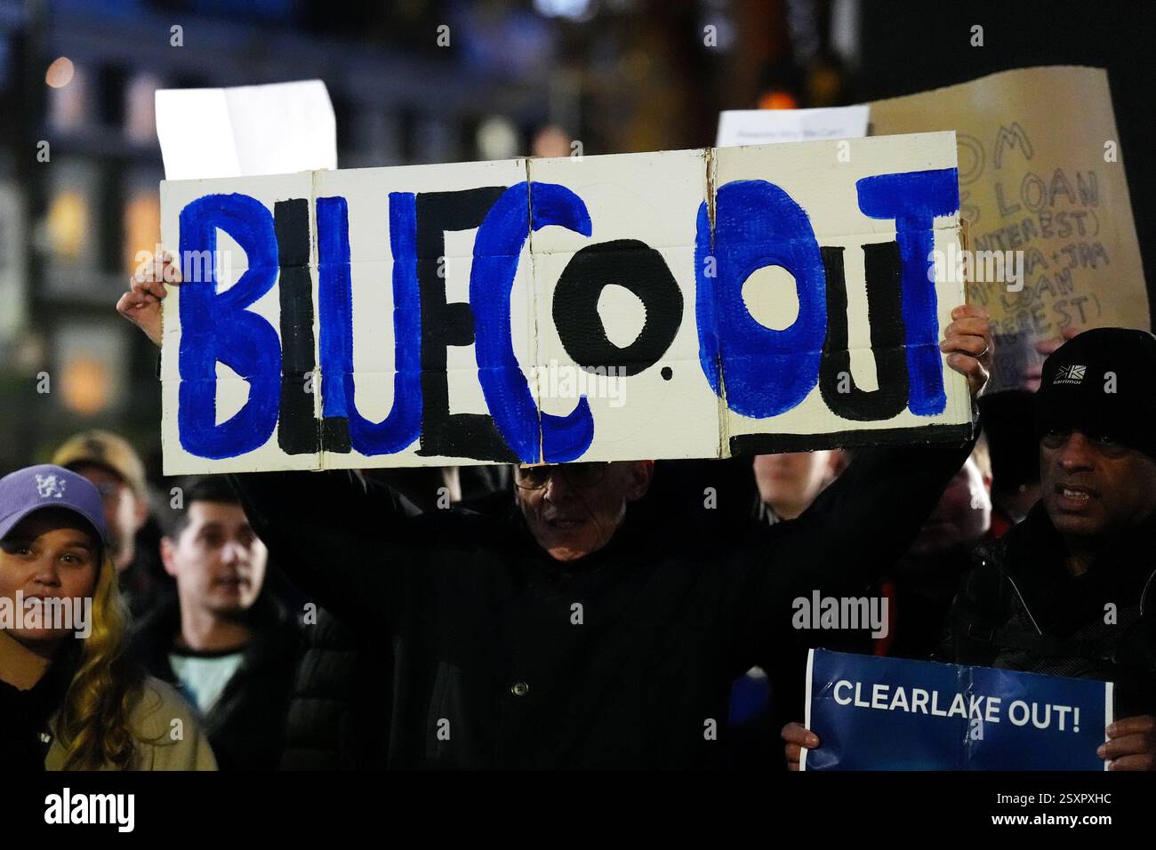 Chelsea fans holding signs during a fan organized protest against the ...