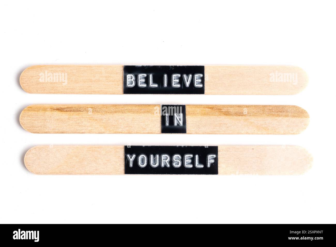 Believe in yourself words written on wooden sticks isolated on white ...