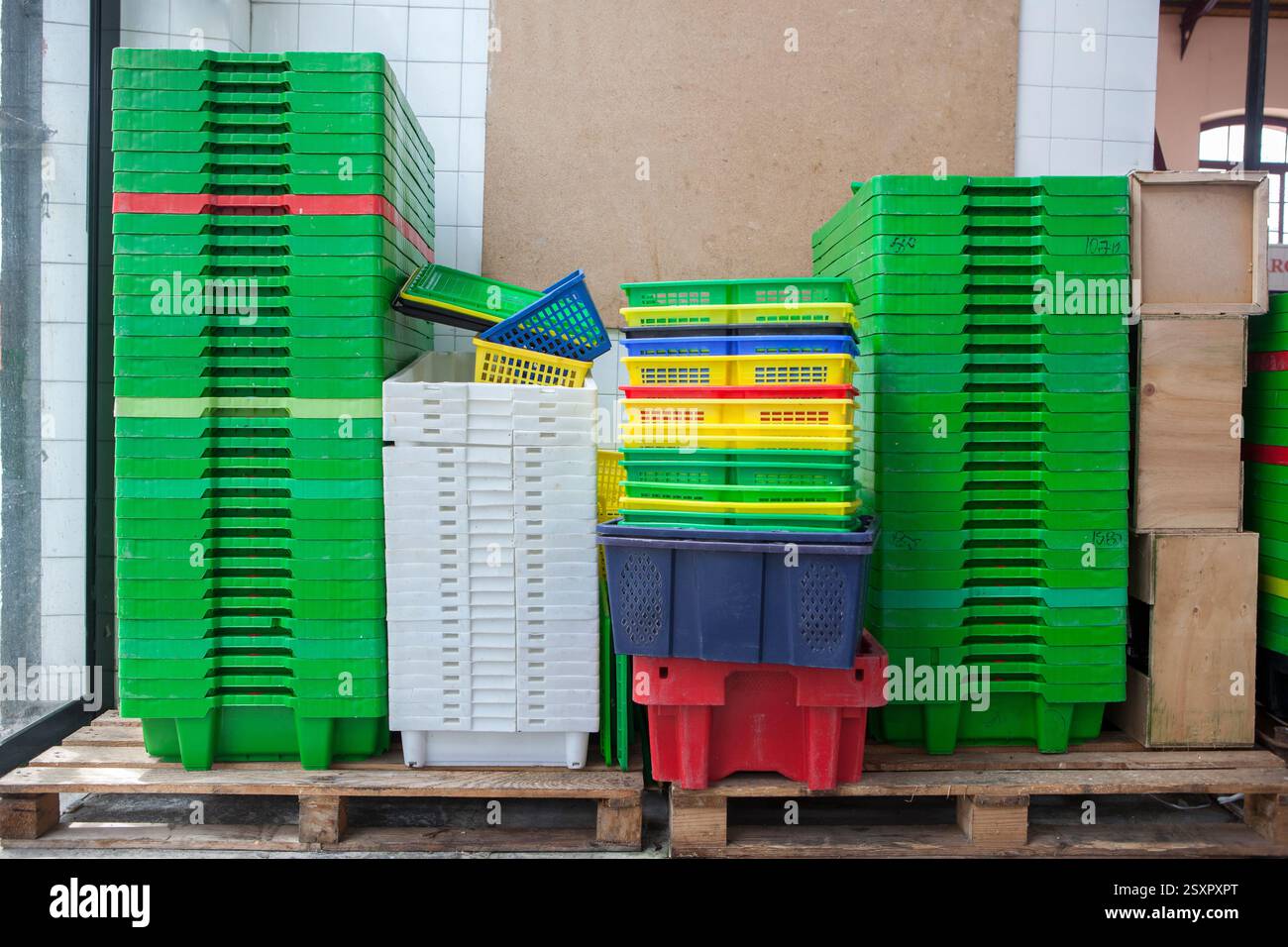 Fish containers compactly stacked together at wholesale market. Fish ...